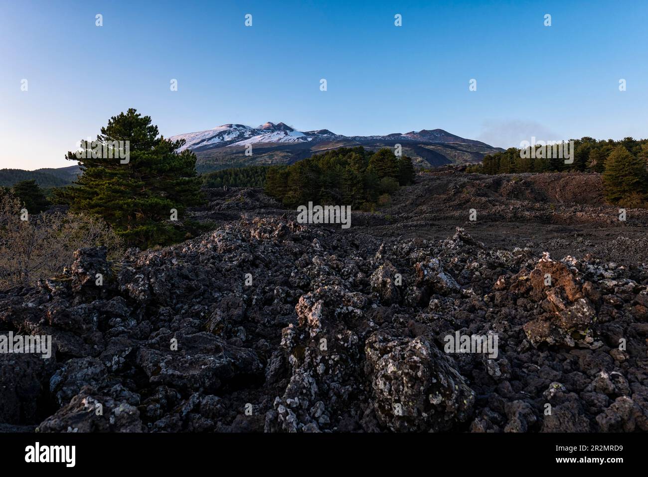 Cold lava flow on mount Etna volcano at sunset Stock Photo - Alamy