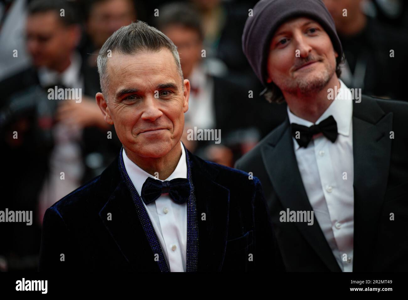 Robbie Williams, left, and Michael Gracey pose for photographers upon ...