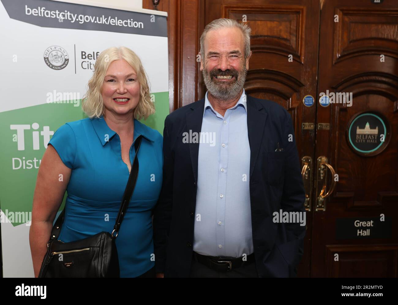 Alliance Party candidate David Bell (right) celebrates winning a seat ...