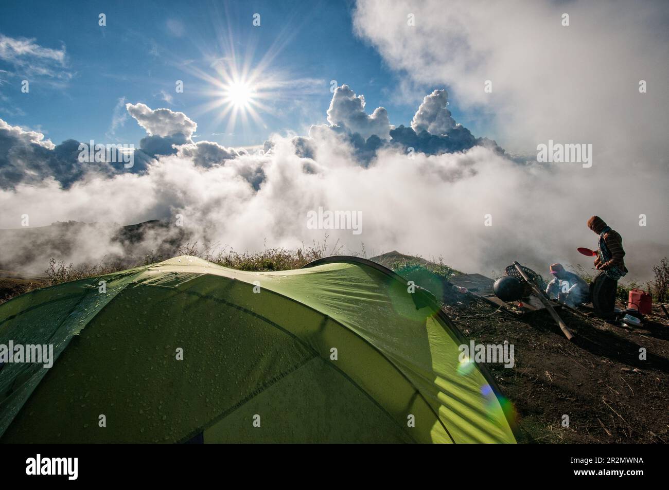 Sun and clouds at Senaru camp crater rim on Mount Rinjani, Lombok ...