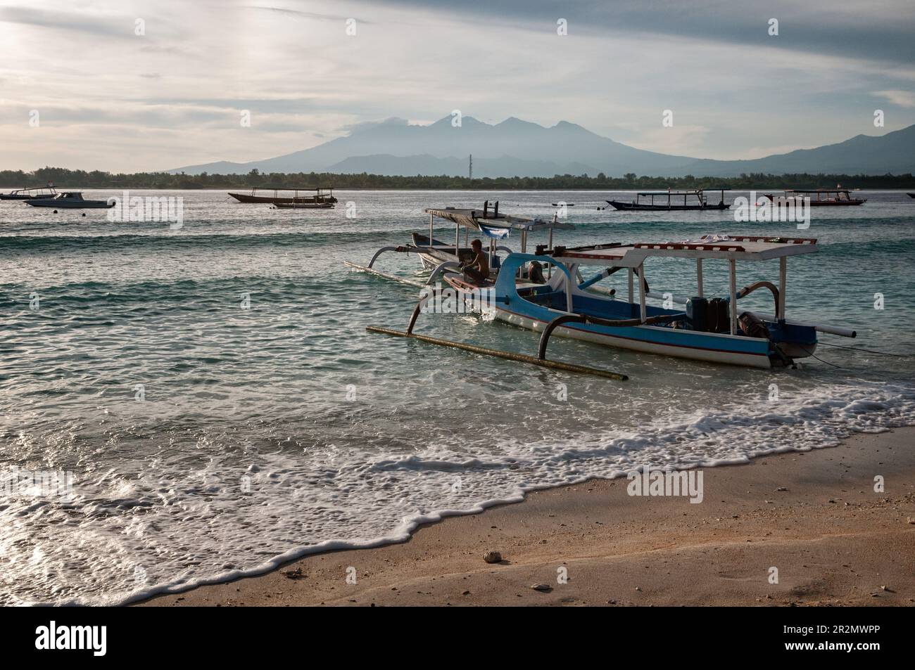 Boats and Mount Rinjani from Gili Trawangan, Lombok, Indonesia Stock ...