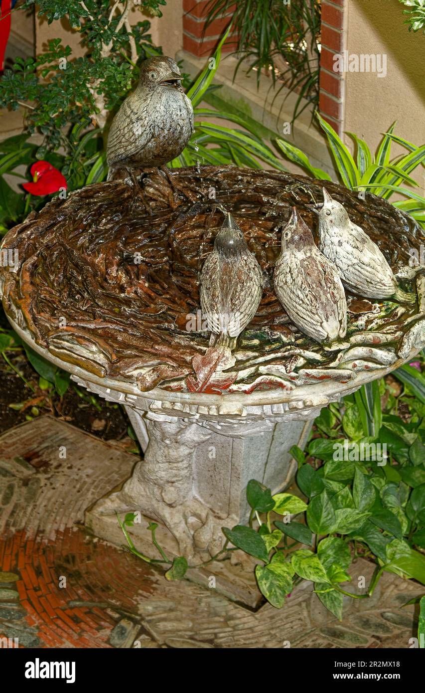 bird bath fountain, stone, water spouting from mouths of 4 birds ...