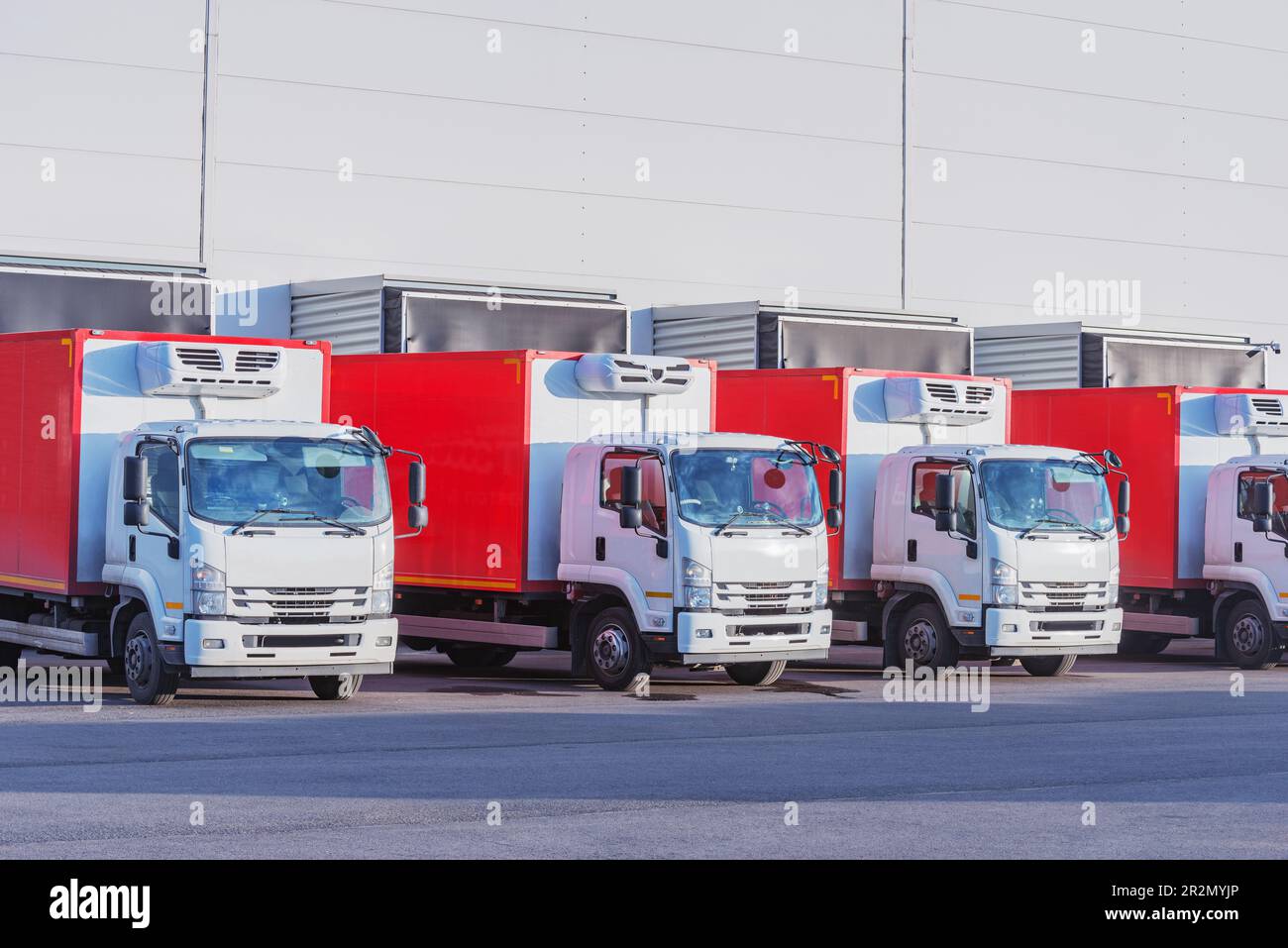 Freight trucks stand by the door of the storage Stock Photo - Alamy