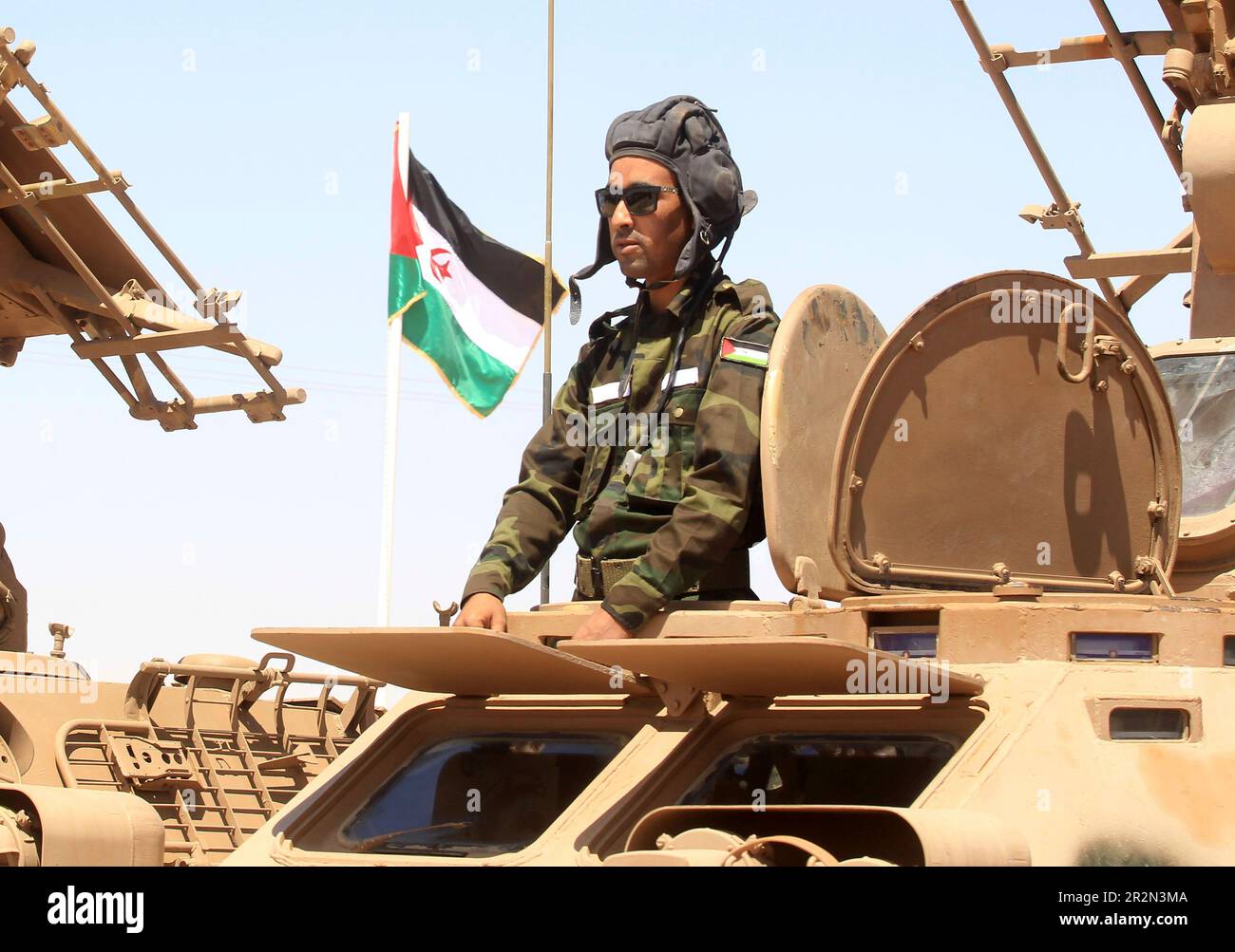 A Polisario Front soldier stand on an armoured vehicle during a ...