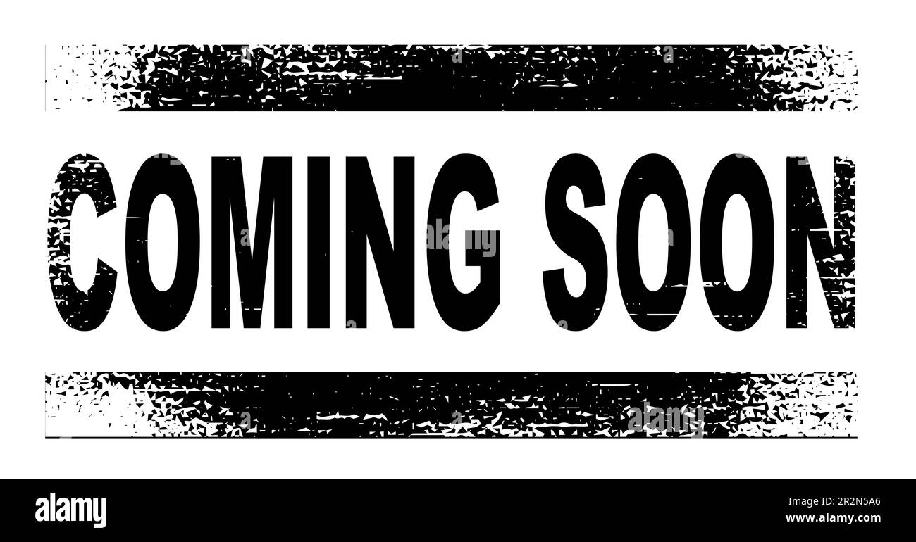 A Coming Soon black rubber ink stamp with grunge over a white ...