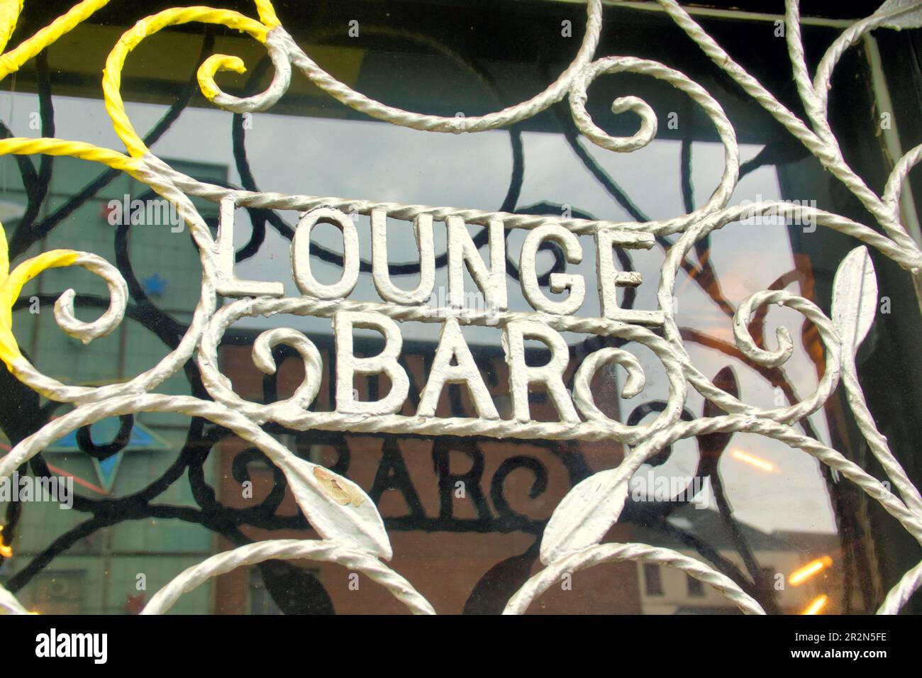 Wrought iron lounge bar sign hi-res stock photography and images - Alamy