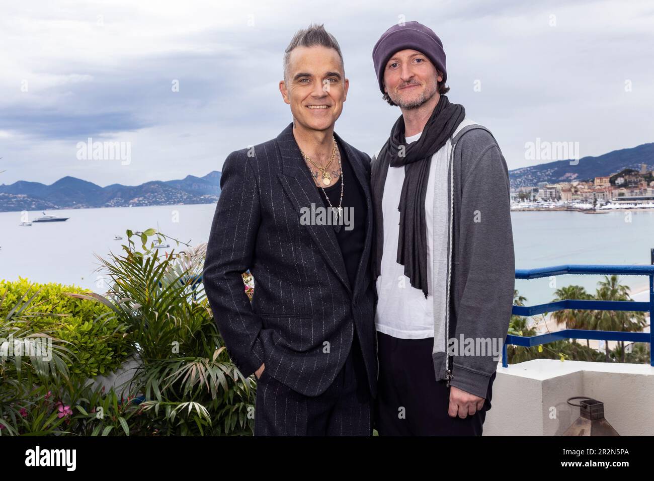 Robbie Williams, left, and director Michael Gracey pose for portrait ...