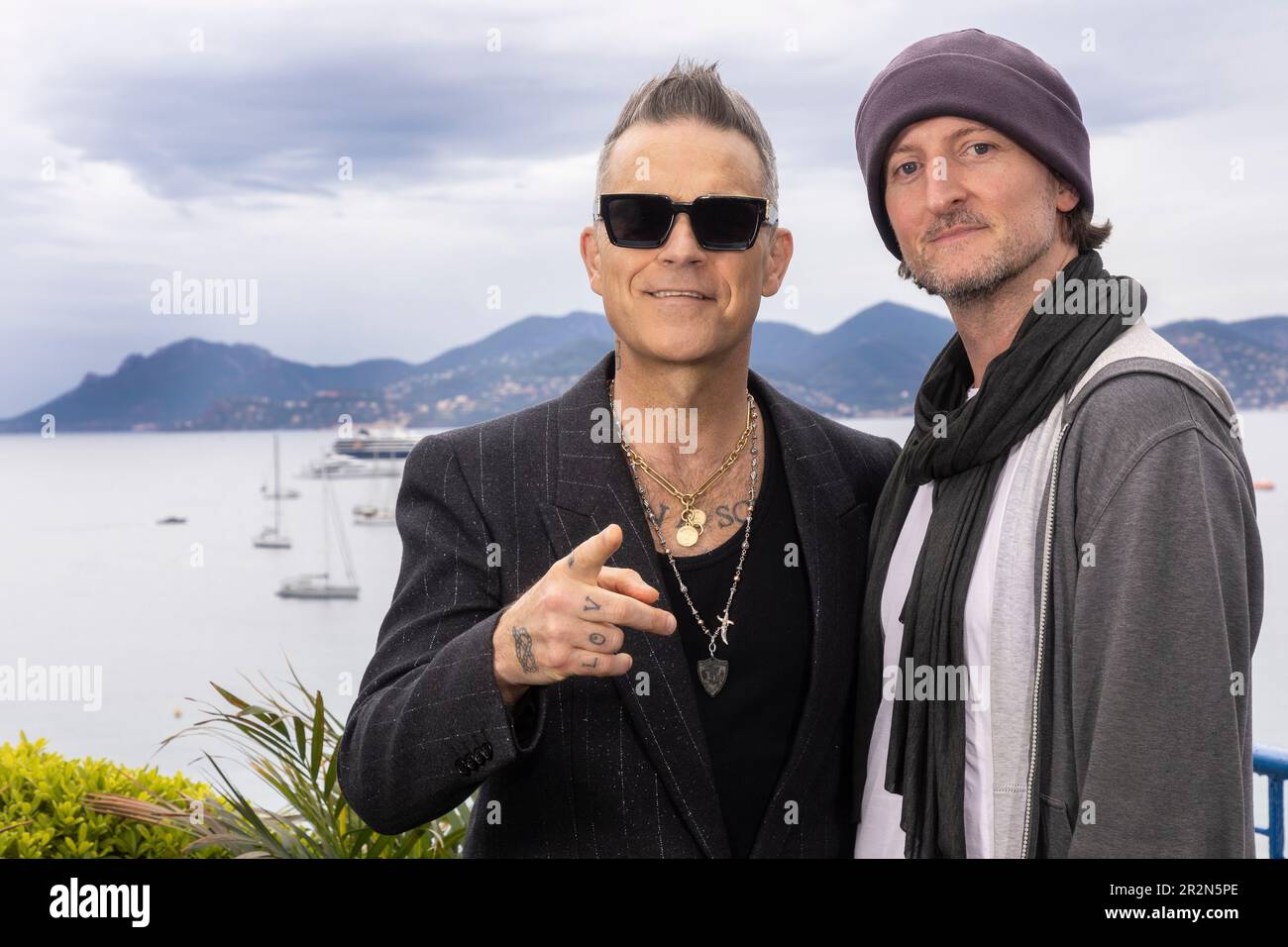 Robbie Williams, left, and director Michael Gracey pose for portrait ...
