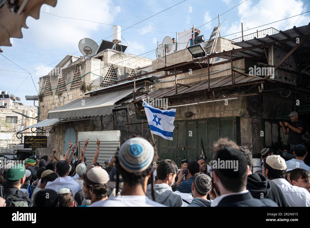 Israeli religious youth gestures at the Palestinians during the ...