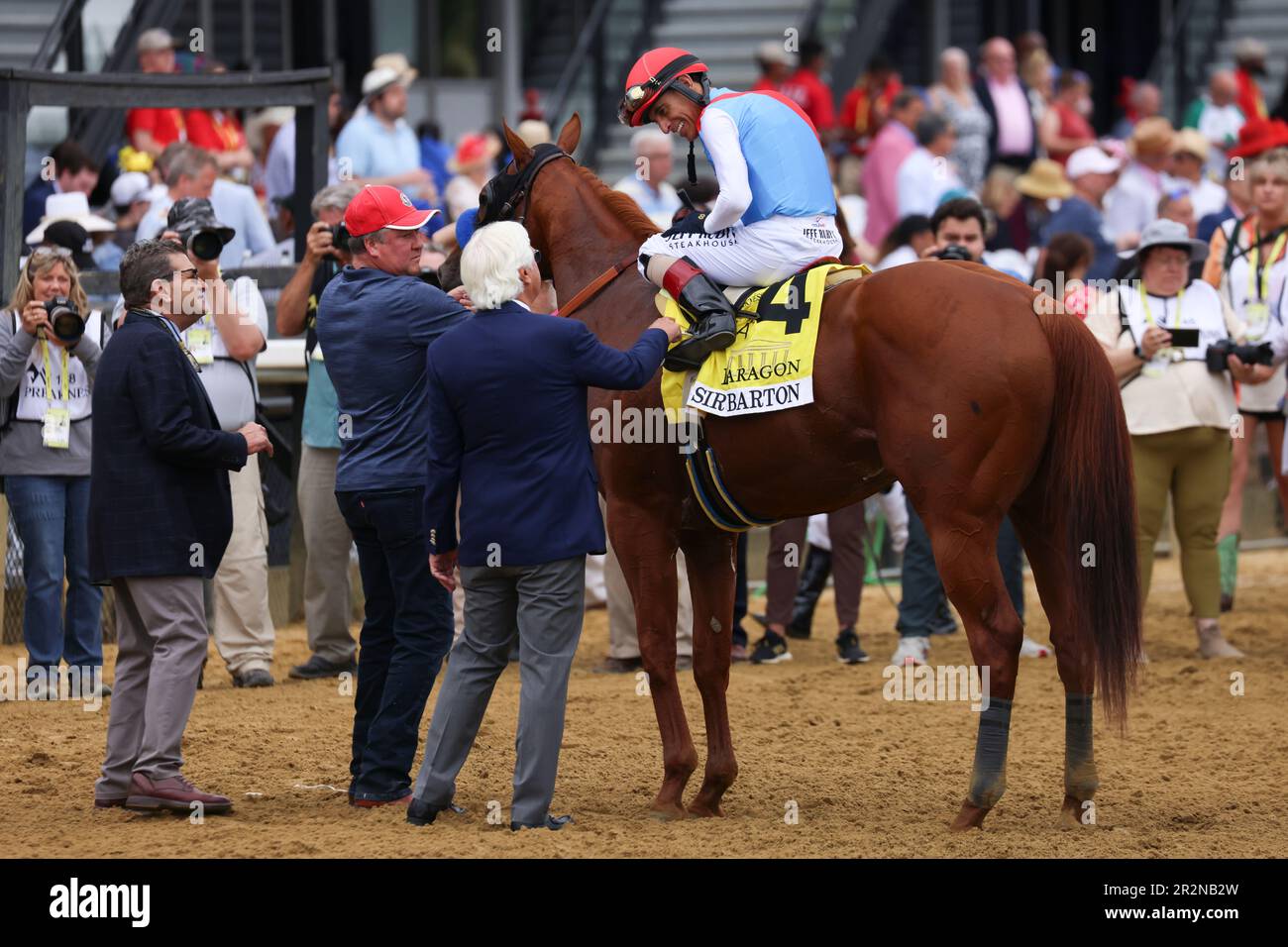 Trainer Bob Baffert, center, greets Arabian Lion, with jockey John ...