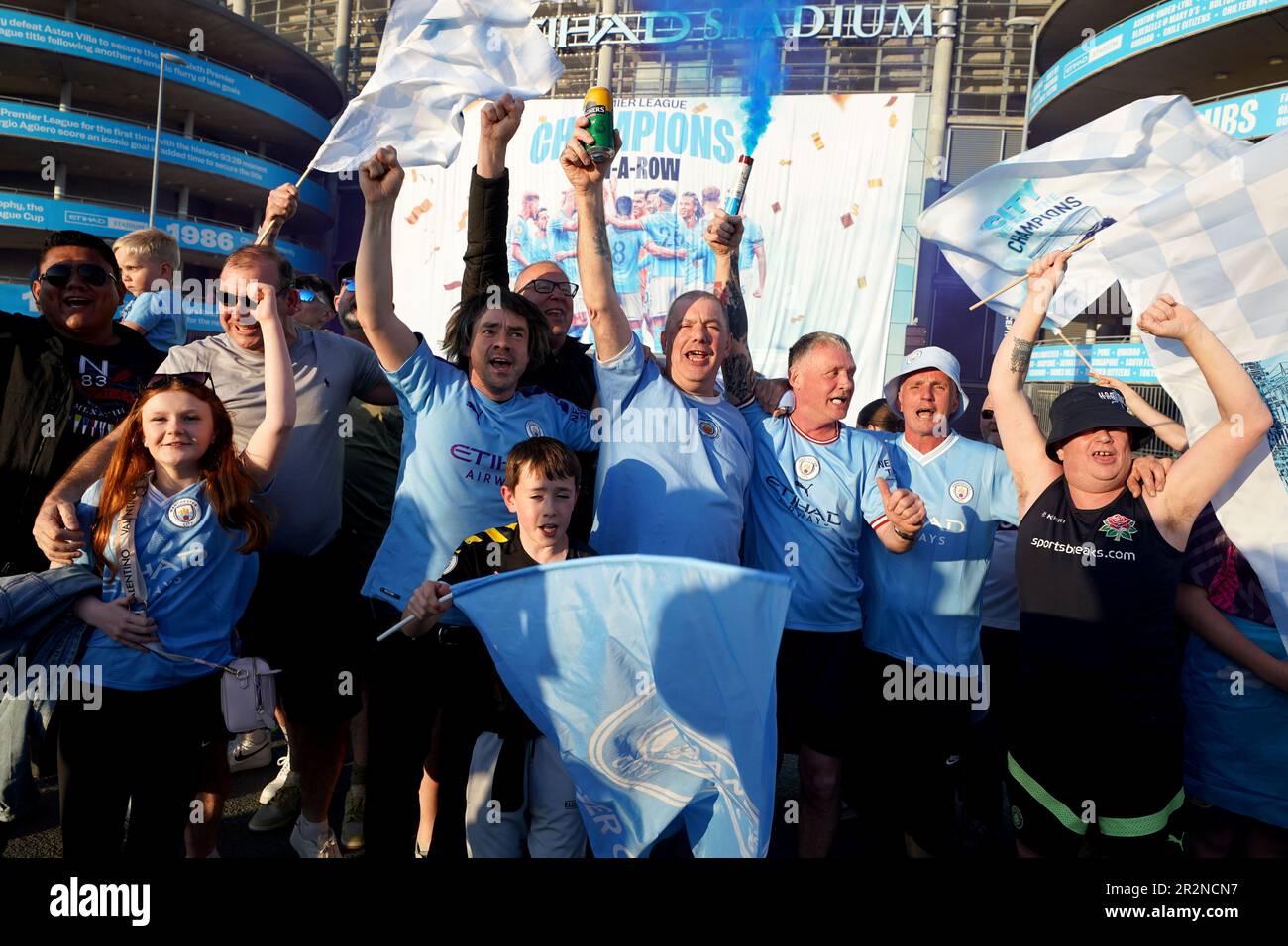 Manchester City fans celebrate outside of the Etihad Stadium after ...
