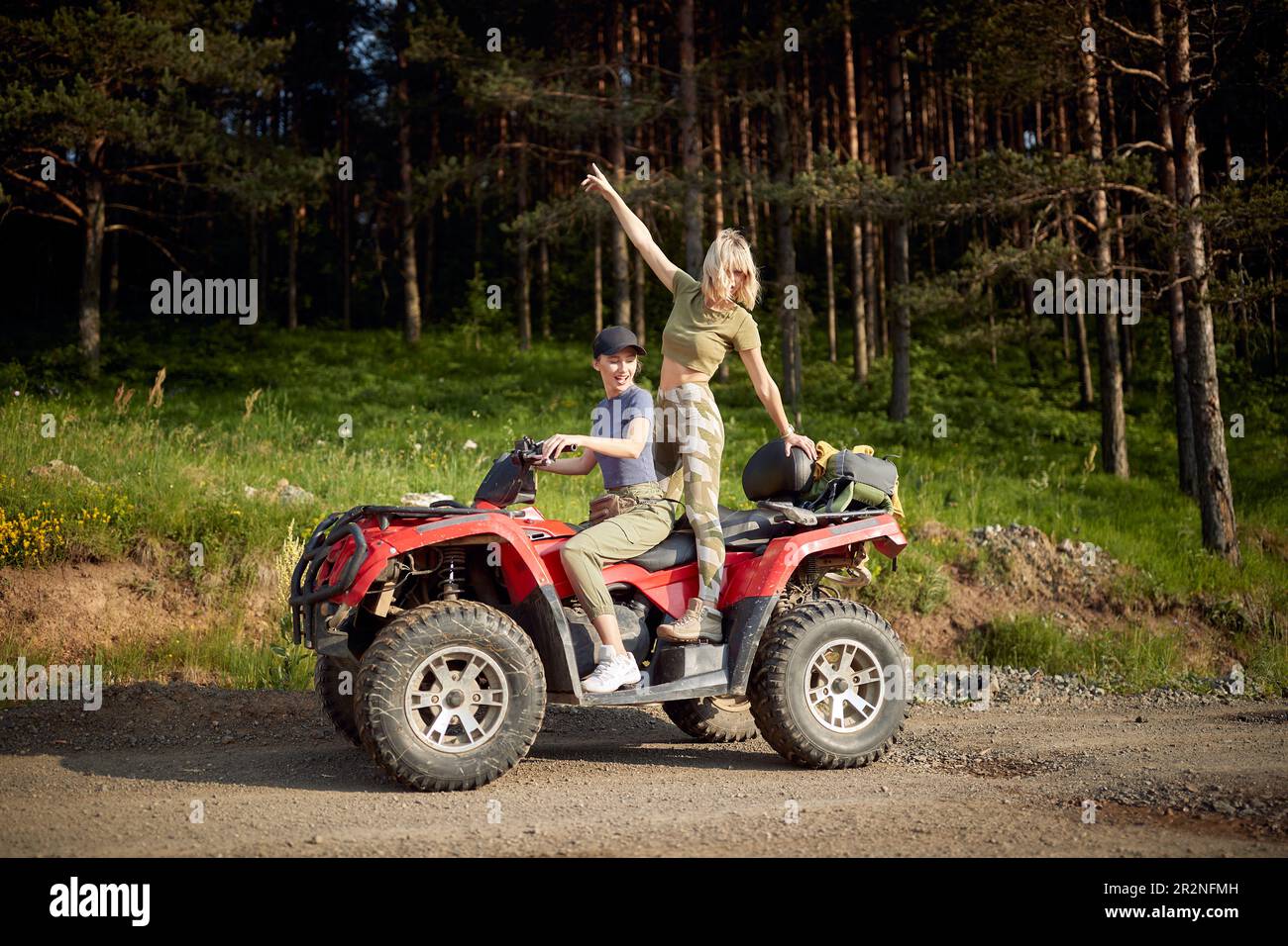 young happy women driving a off road quad Stock Photo - Alamy