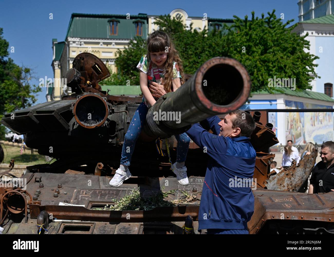 A child seen seated on top of a destroyed captured Russian tank which ...