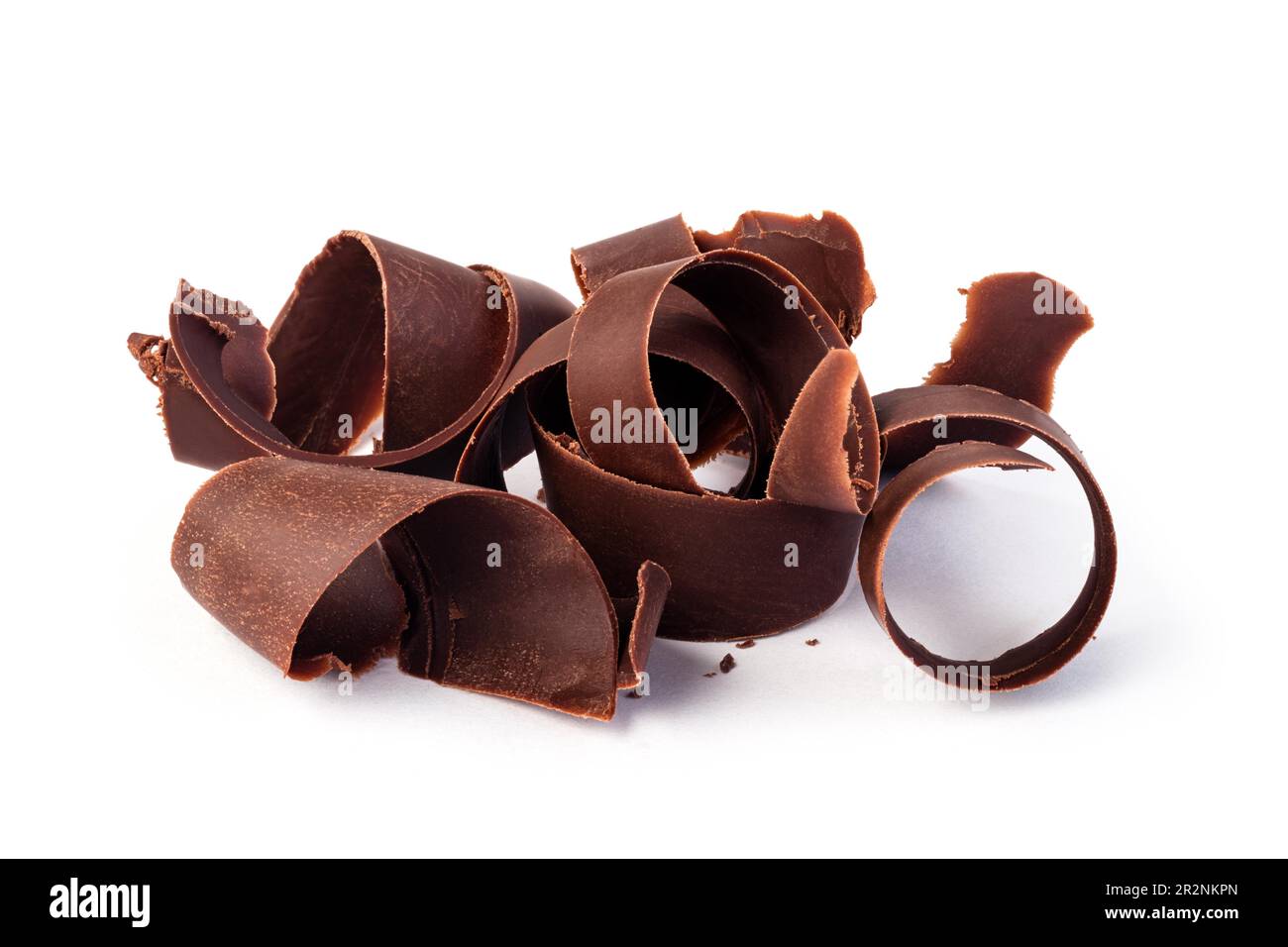 Chocolate shavings on white background Stock Photo - Alamy