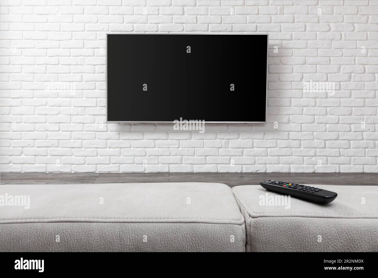 living room led tv on white wall Stock Photo - Alamy