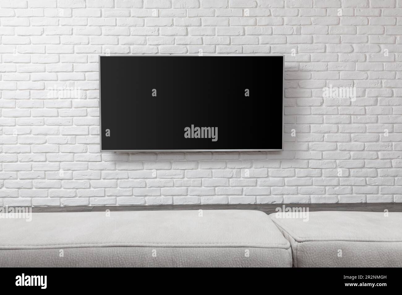 living room led tv on white wall Stock Photo - Alamy