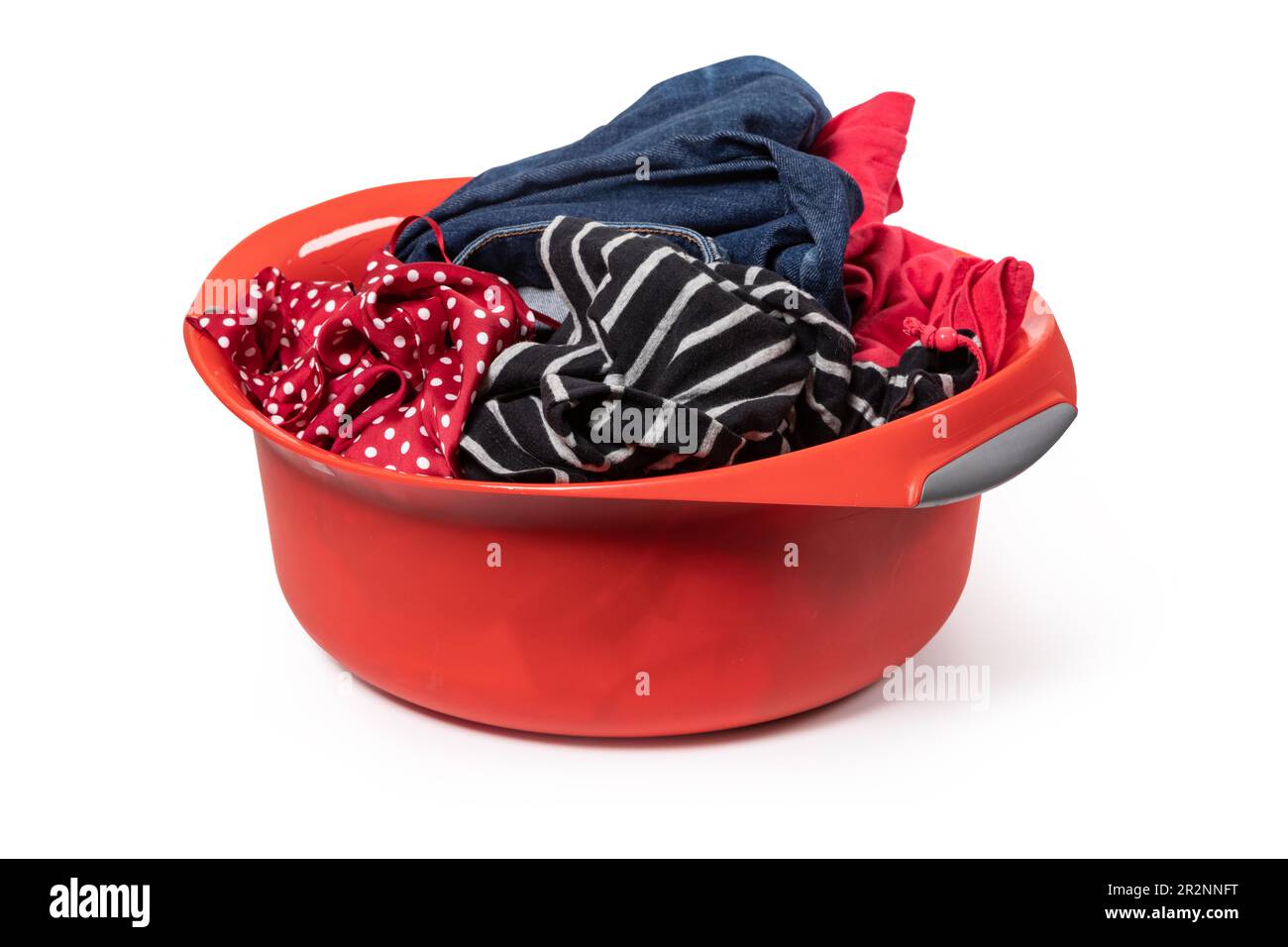 red plastic wash bowl with clothing isolated on white background Stock ...