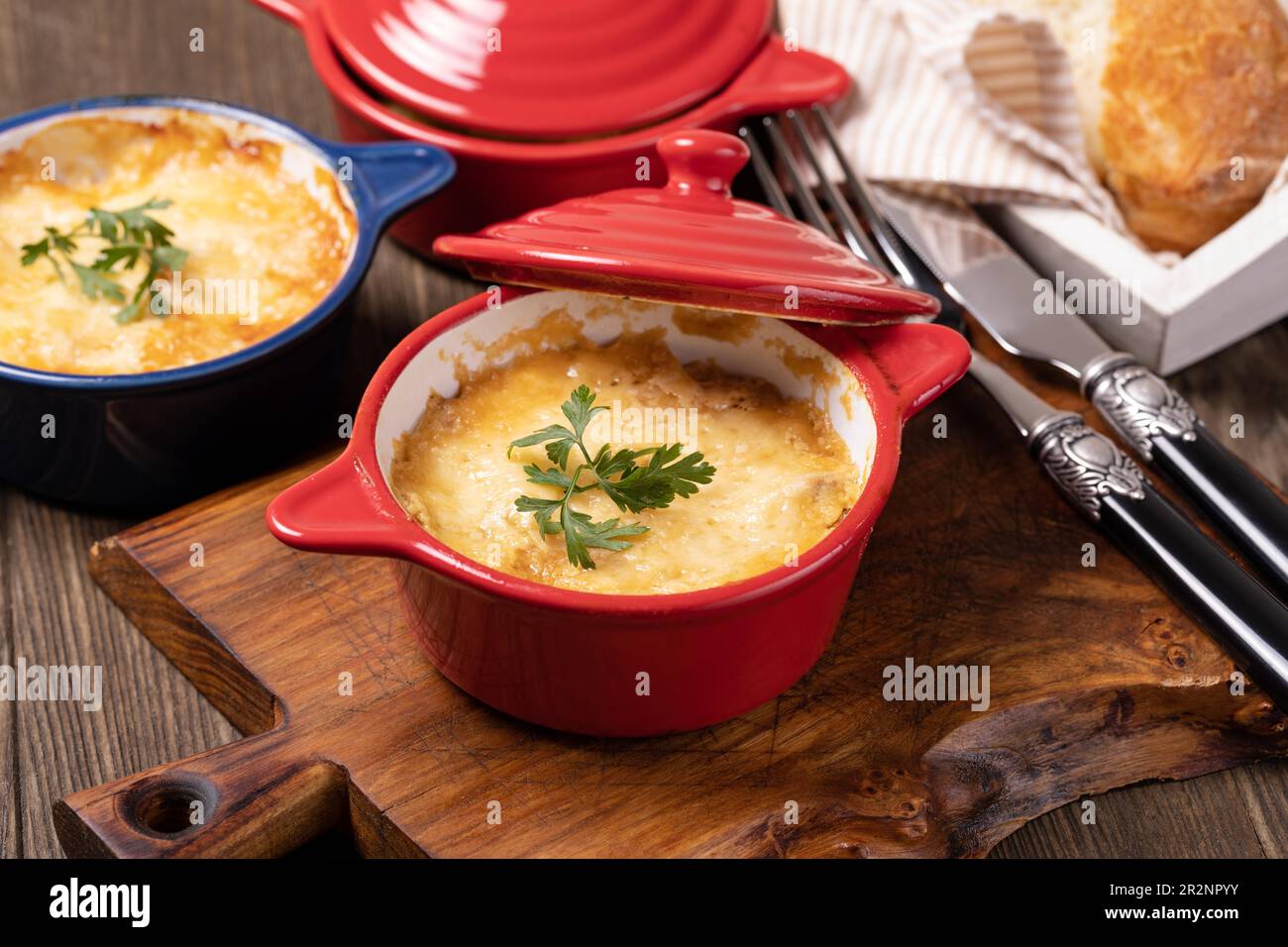 Baked mushroom julienne with chicken and cheese in pots Stock Photo - Alamy