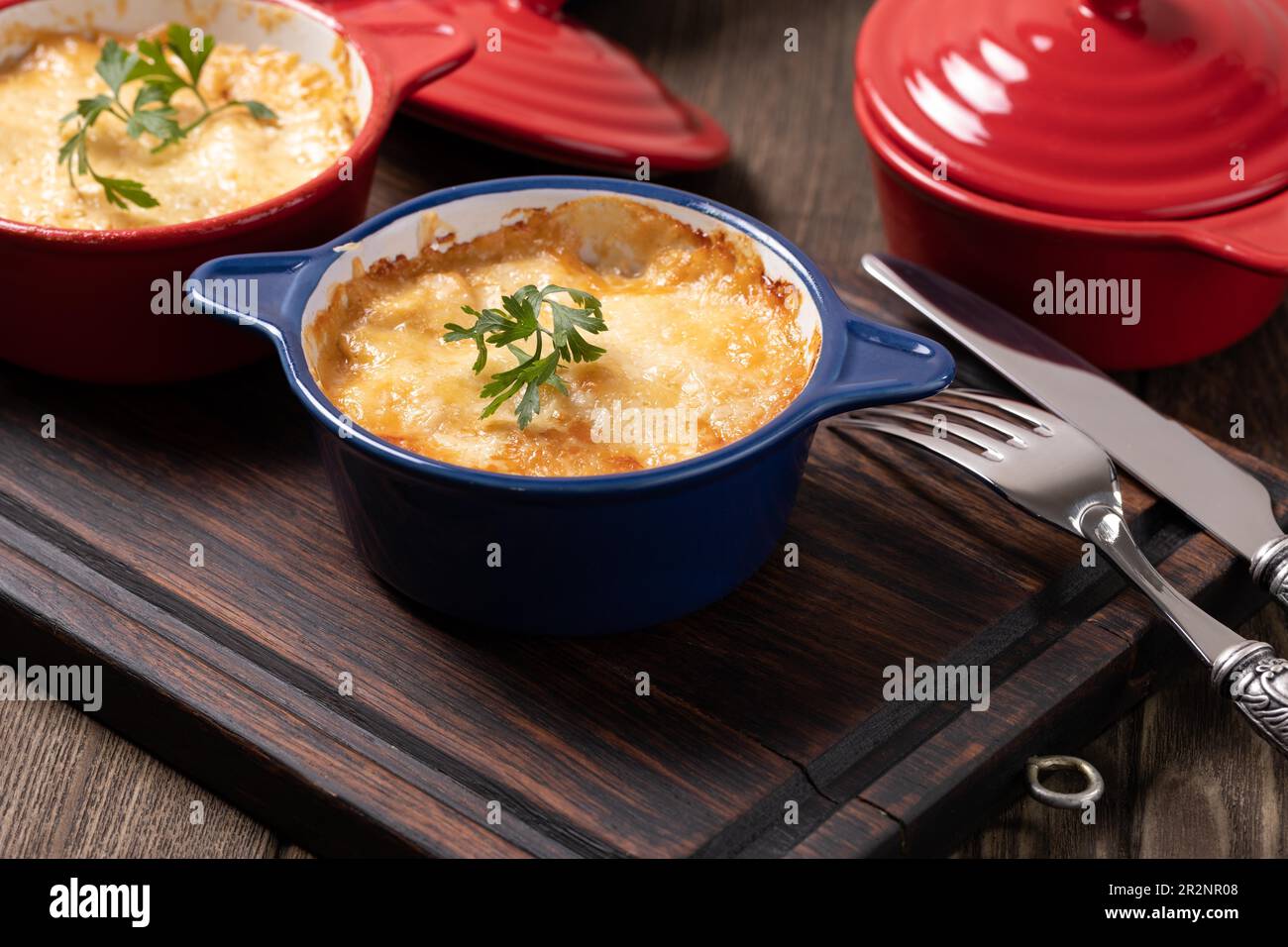 Baked mushroom julienne with chicken and cheese in pots Stock Photo - Alamy