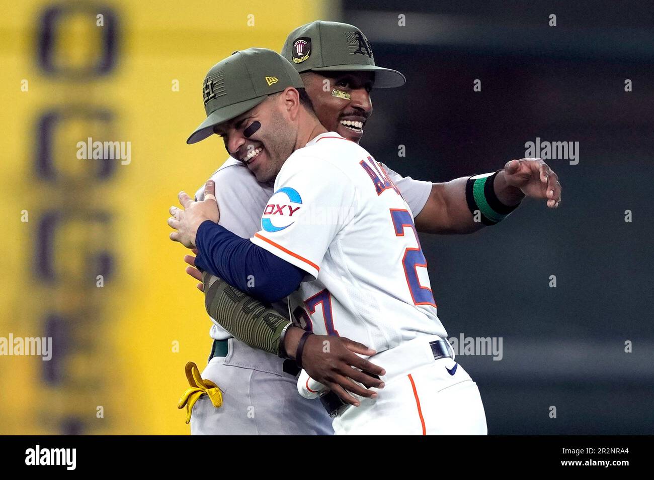 Houston Astros' Jose Altuve, right, and Oakland Athletics' Tony Kemp ...