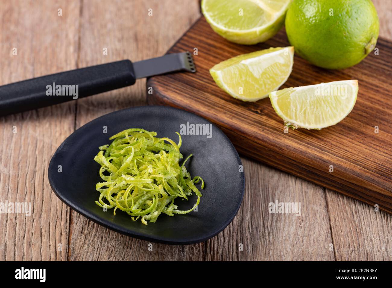 lime zest on a woodwn background Stock Photo - Alamy