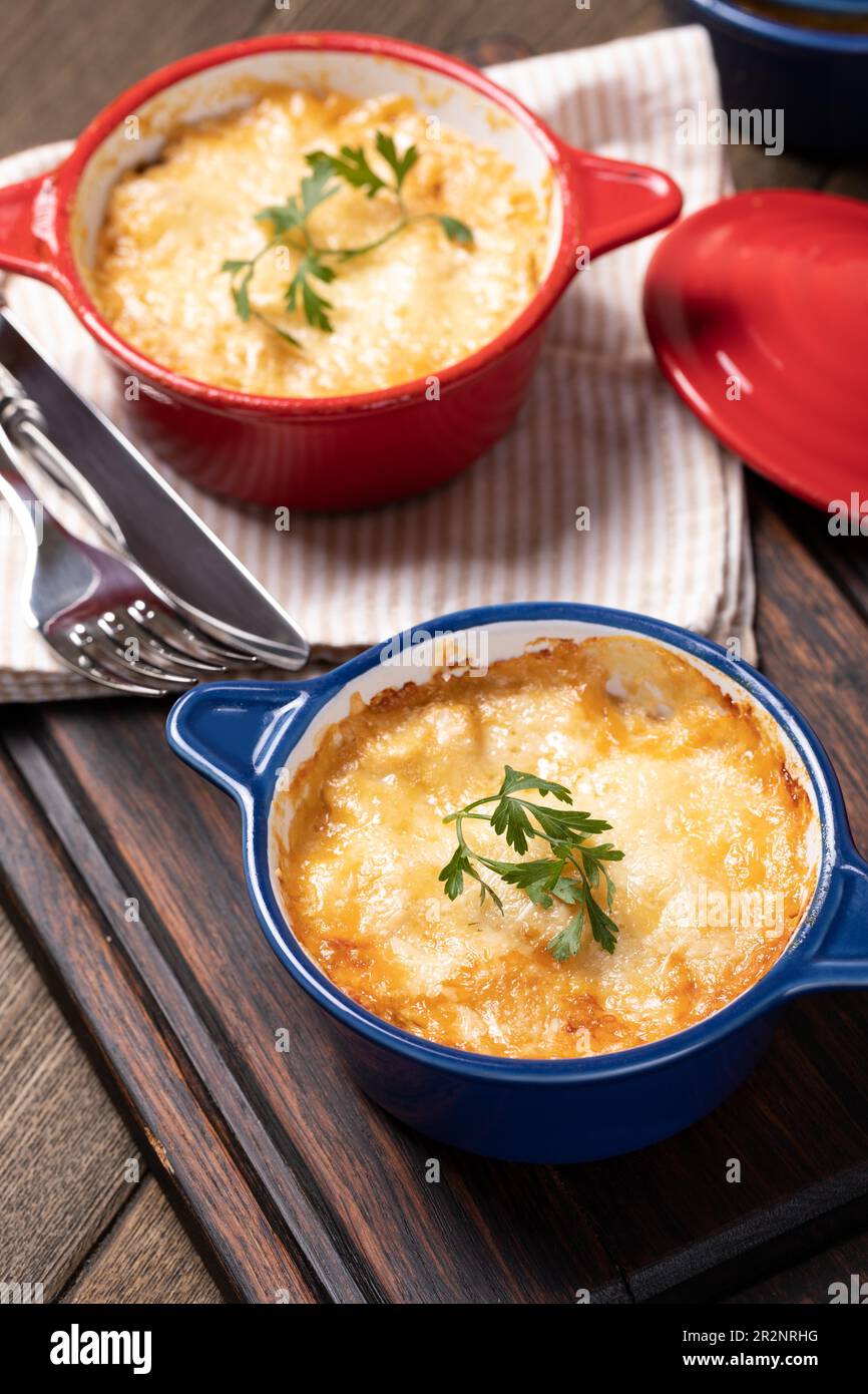 Baked mushroom julienne with chicken and cheese in pots Stock Photo - Alamy