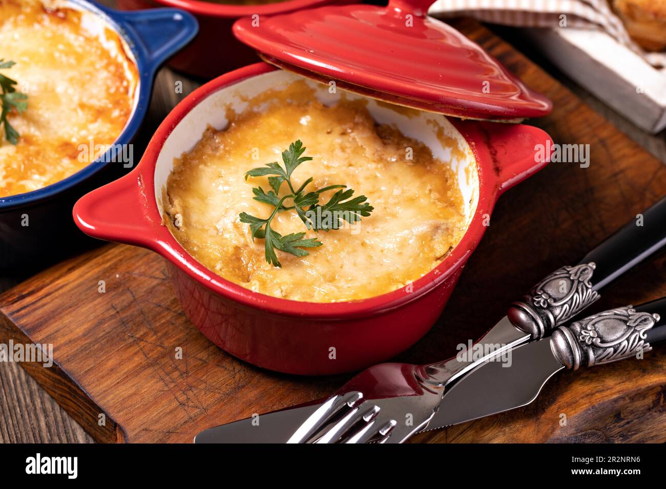 Baked mushroom julienne with chicken and cheese in pots Stock Photo - Alamy