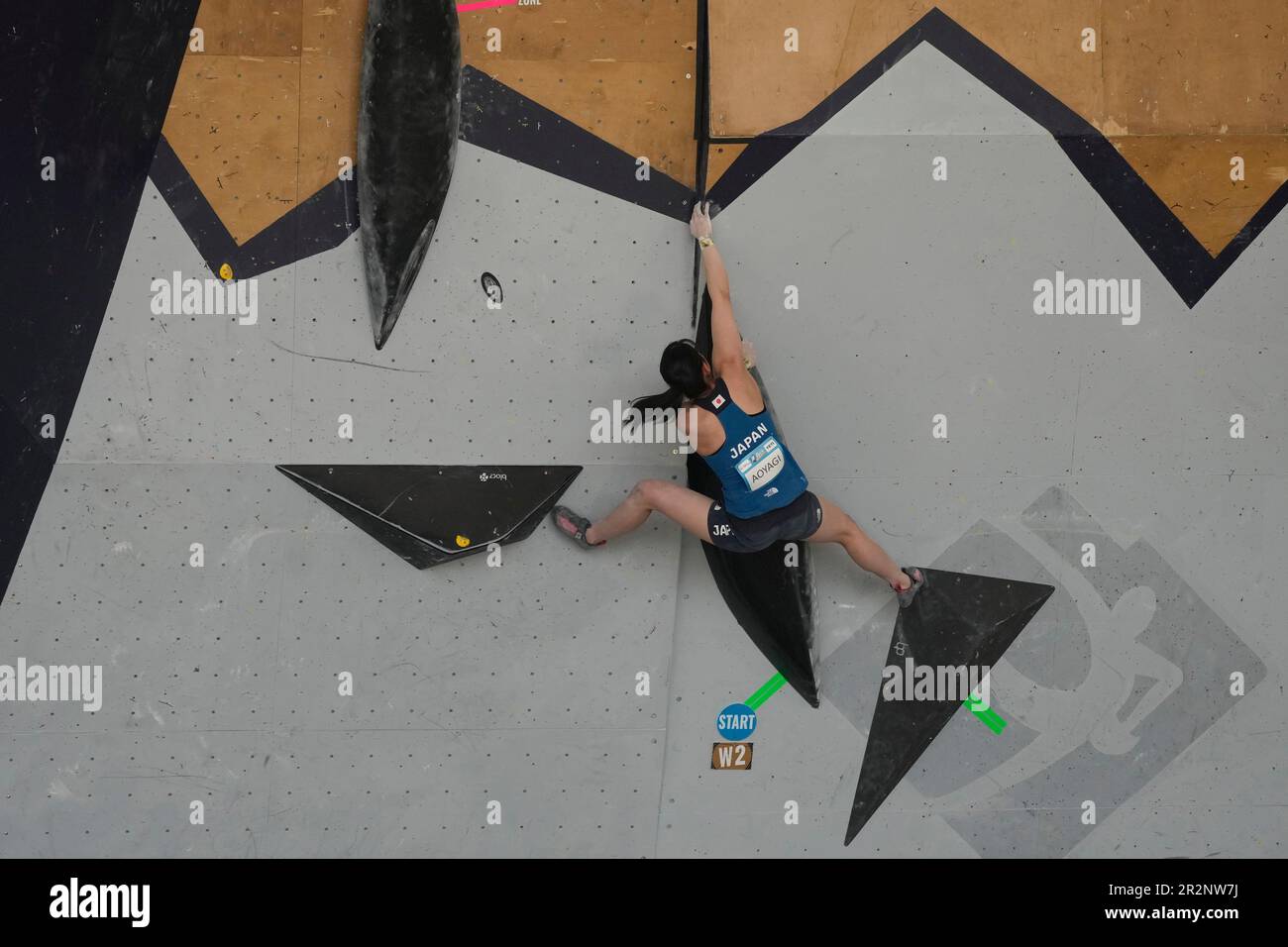Mia Aoyagi, of Japan, competes during the women's boulder semi-finals ...