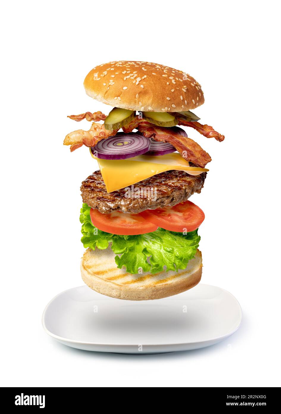Flying burger isolated on a white background Stock Photo - Alamy