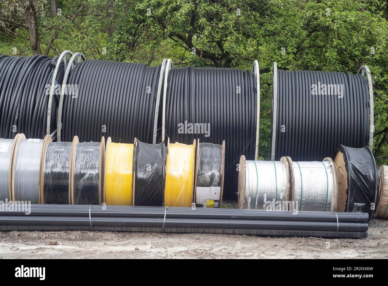 rolls of cables on constructionsite Stock Photo - Alamy
