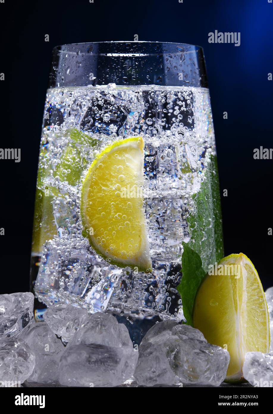 Glass of mineral water with ice, lime and mint Stock Photo - Alamy