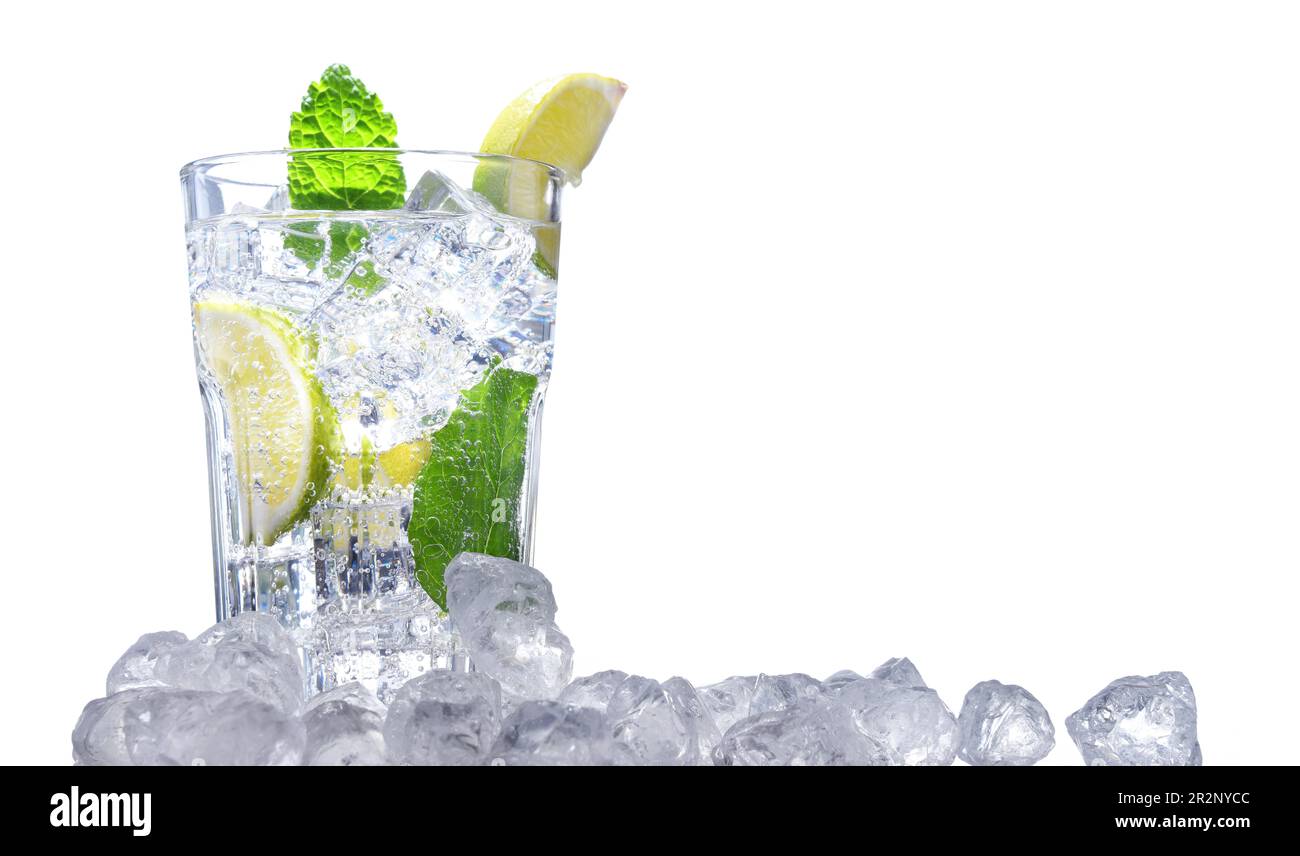 Glass of mineral water with ice, lime and mint isolated on white Stock ...