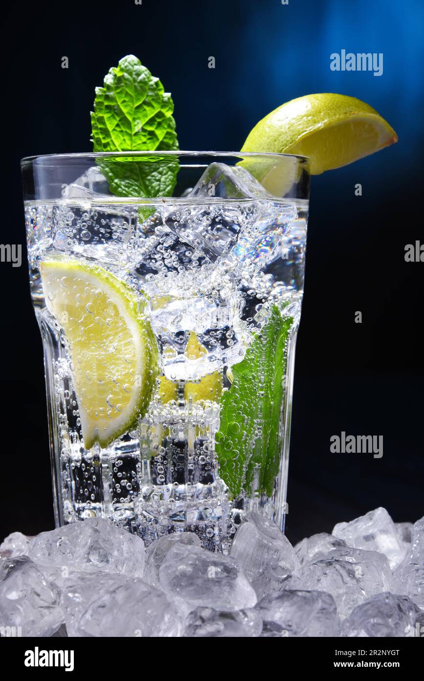 Glass of mineral water with ice, lime and mint Stock Photo - Alamy