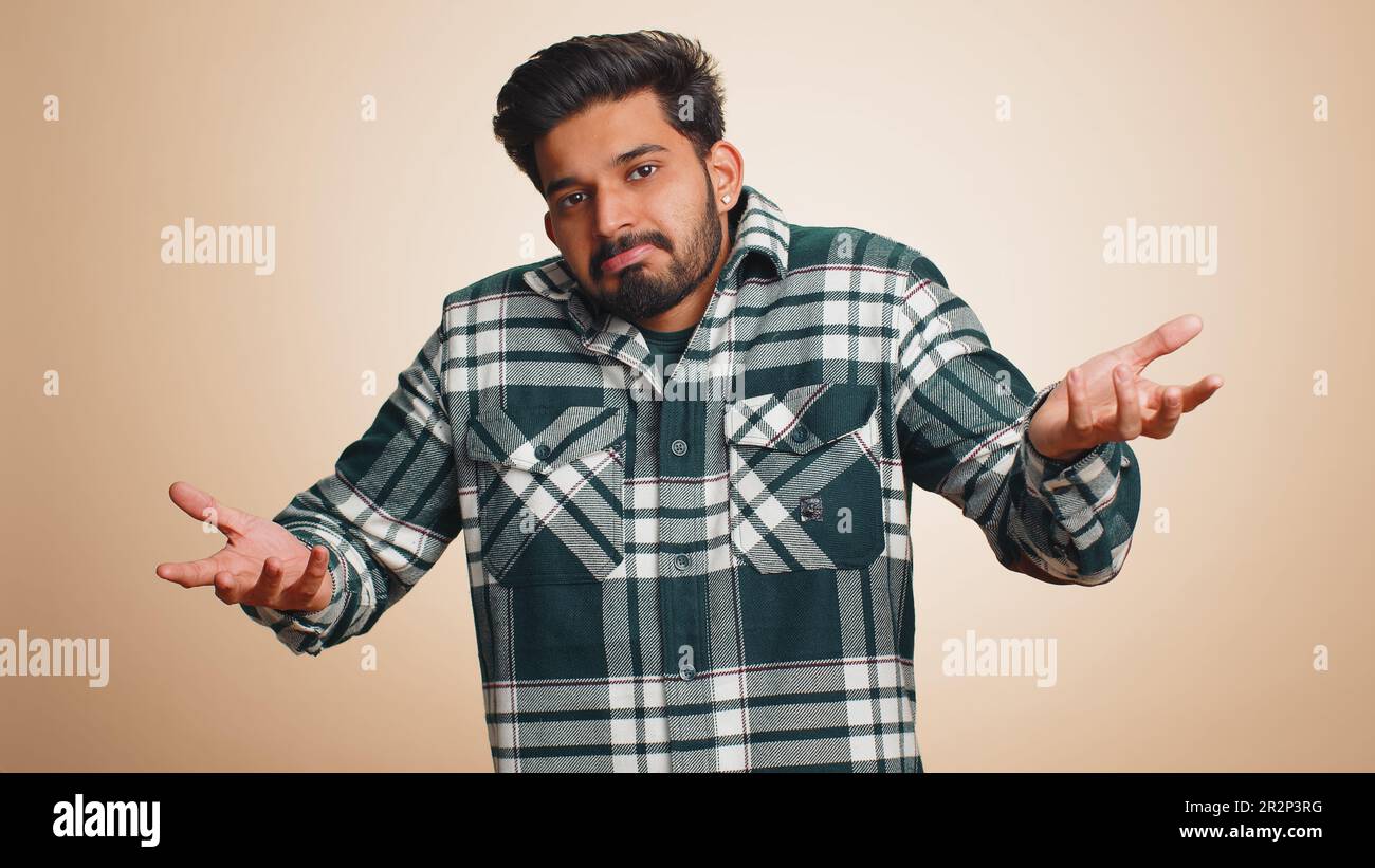 No idea, I dont know answer. Puzzled clueless uncertain indian handsome ...