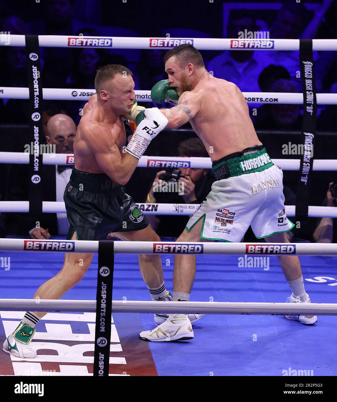 James Metcalf (right) in action against Dennis Hogan after their IBO Super-Welterweight World ...