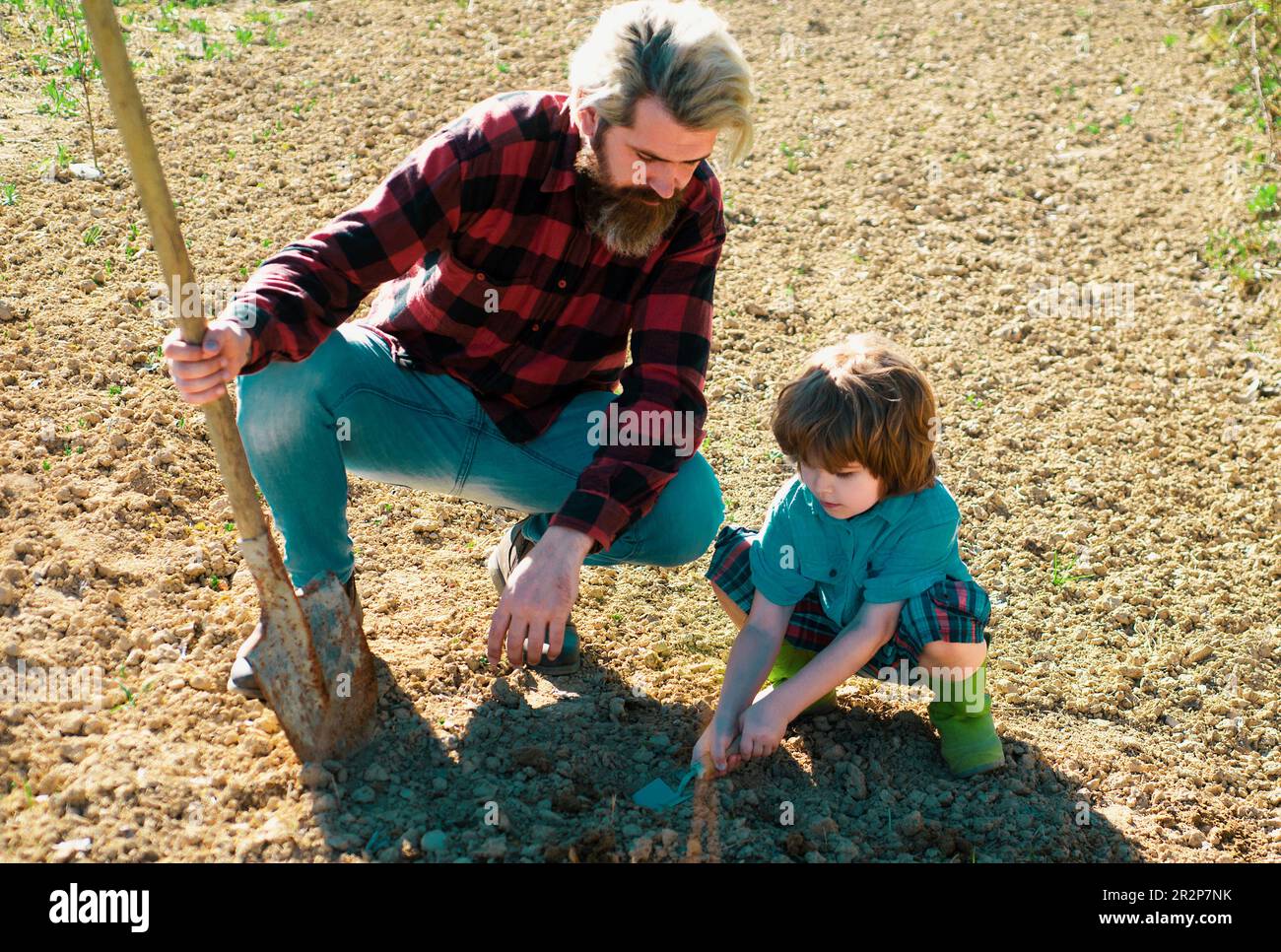 Father adult son cultivating hi-res stock photography and images - Alamy