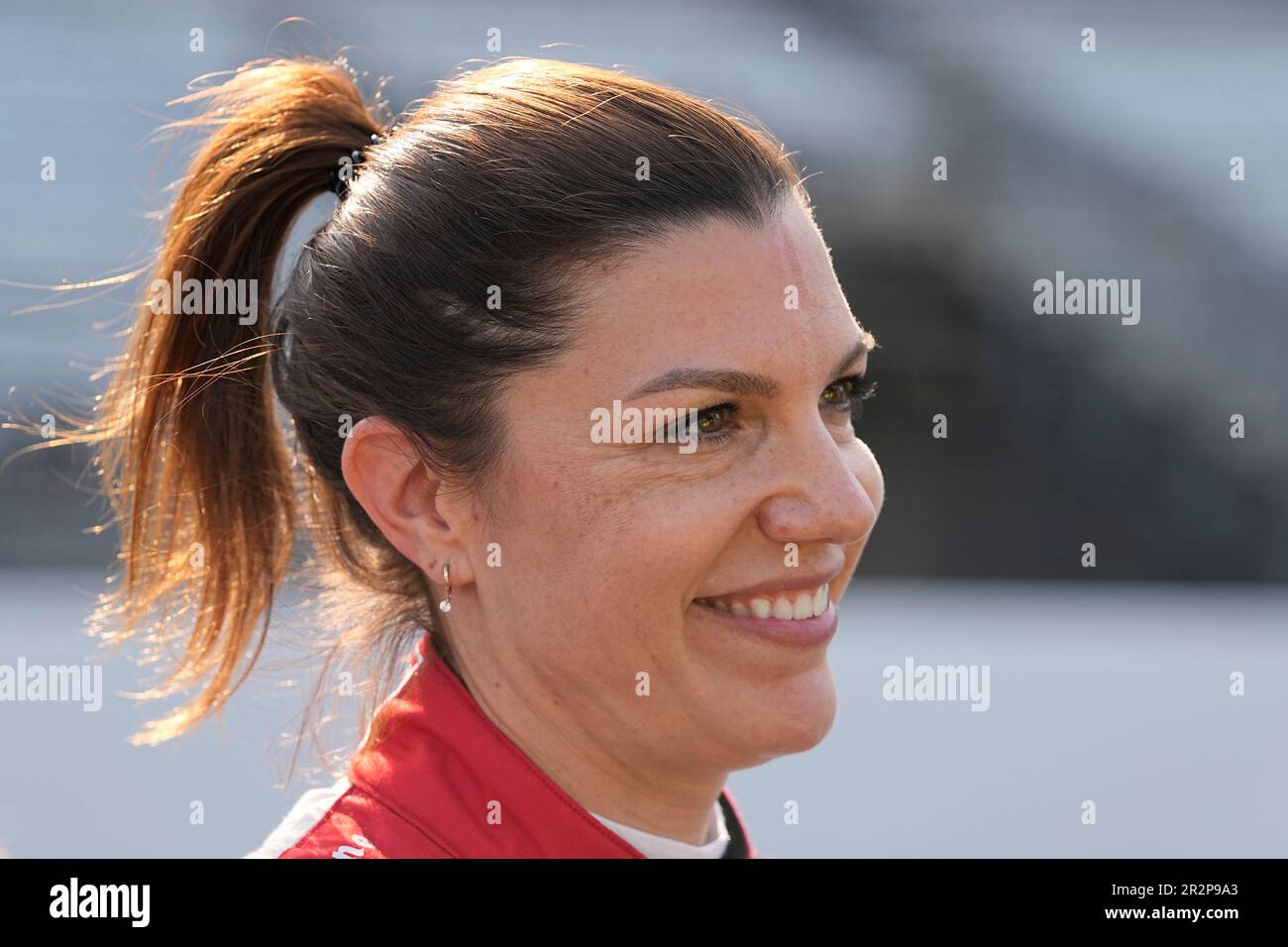 Katherine Legge, of England, smiles after she qualified for the ...