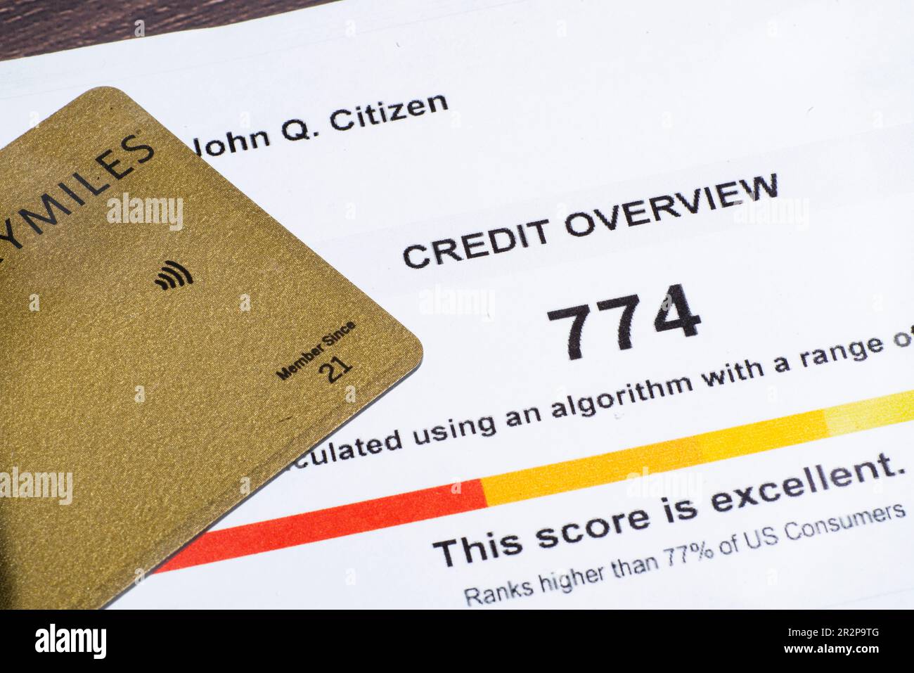 Corner of credit card on fake credit report with score on a desk Stock ...