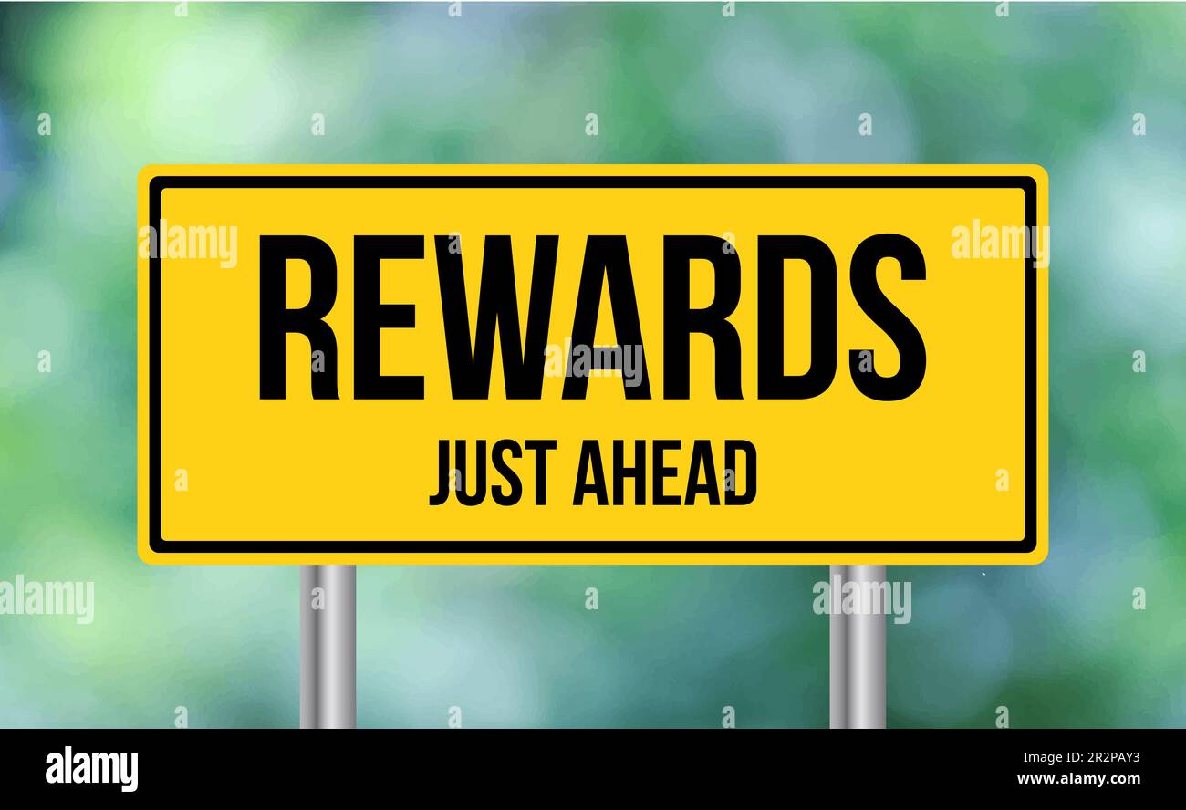 Rewards just ahead road sign on blur background Stock Photo - Alamy