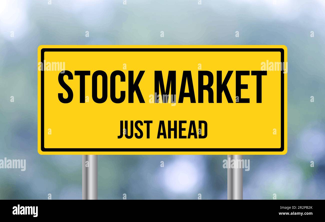 Stock Market just ahead road sign on blur background Stock Photo - Alamy