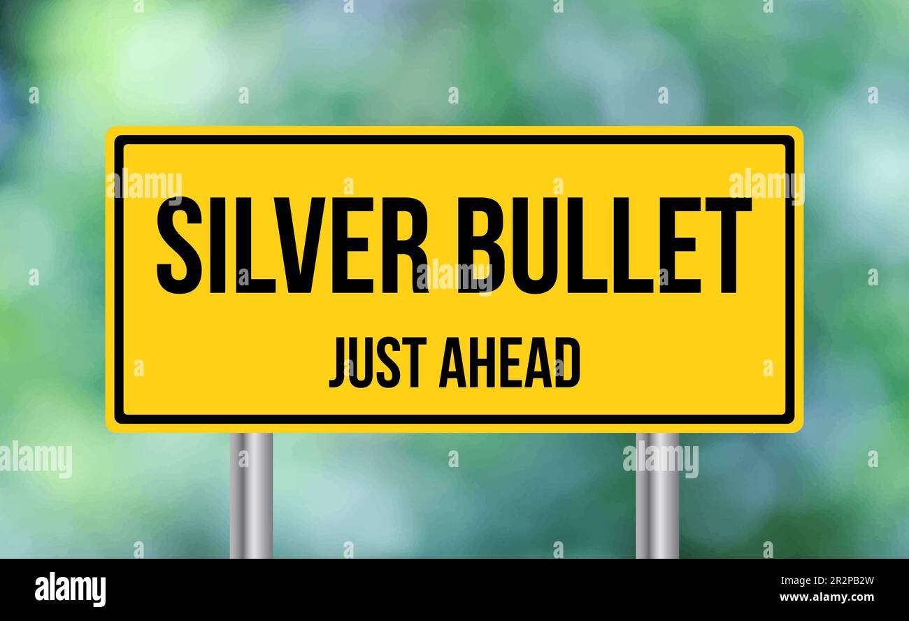 Silver Bullet just ahead road sign on blur background Stock Photo - Alamy