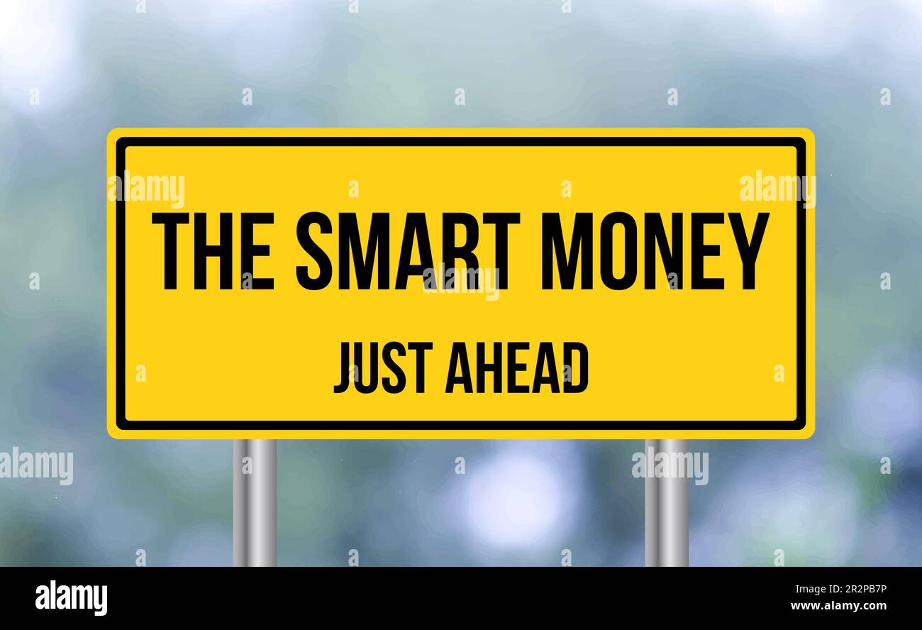 The Smart Money just ahead road sign on blur background Stock Photo - Alamy