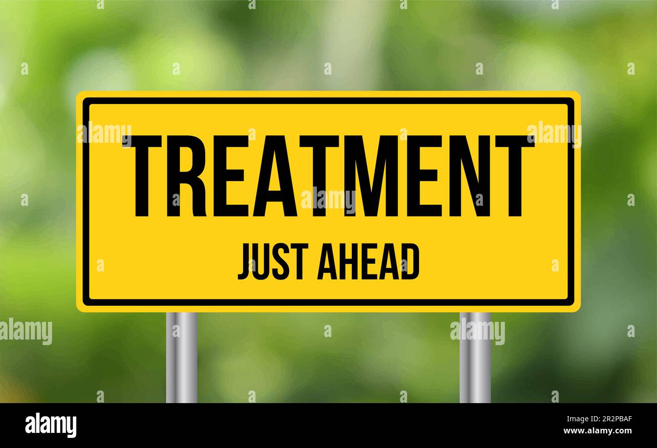 Treatment just ahead road sign on blur background Stock Photo - Alamy