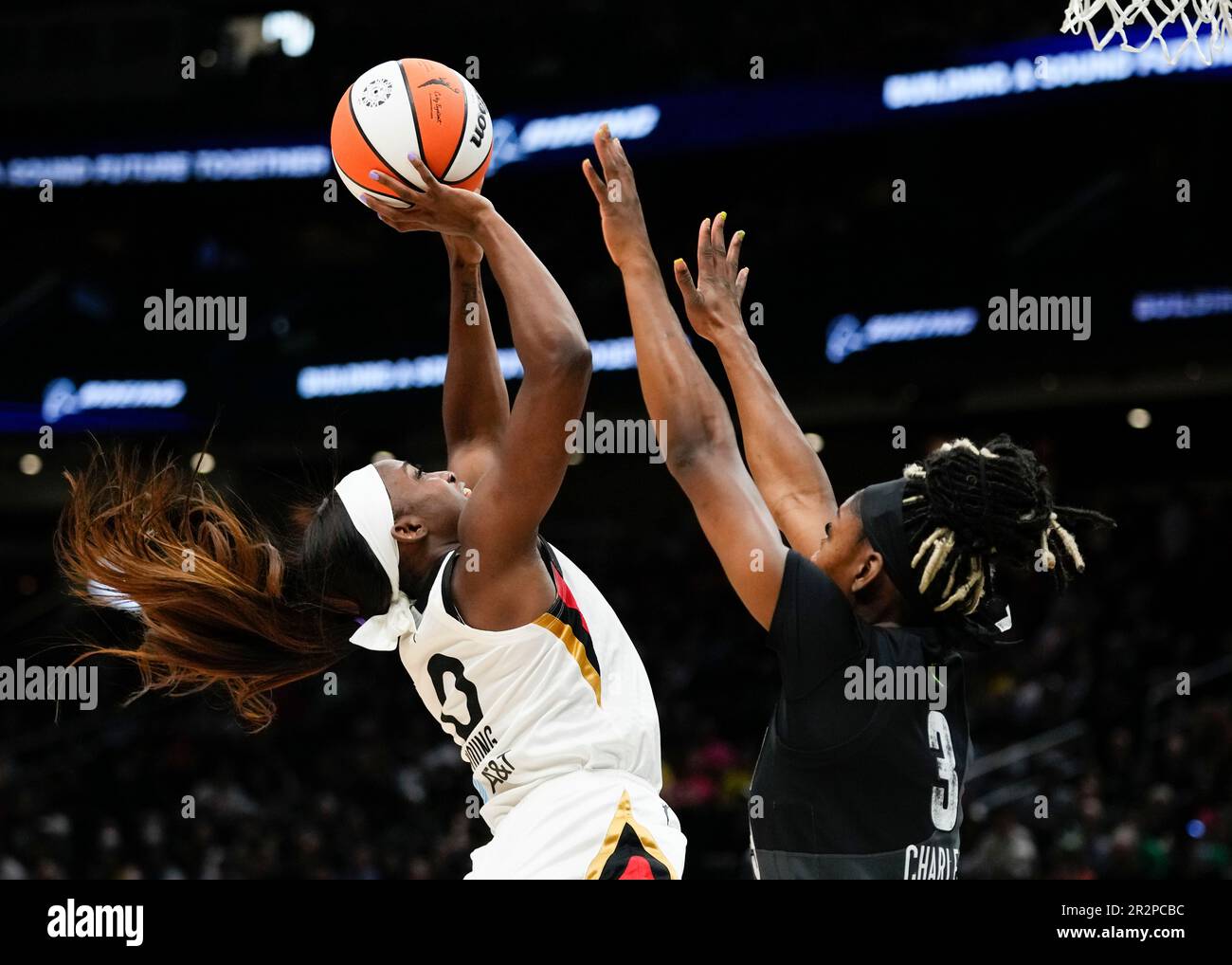 Las Vegas Aces guard Jackie Young (0) drives to the basket against ...