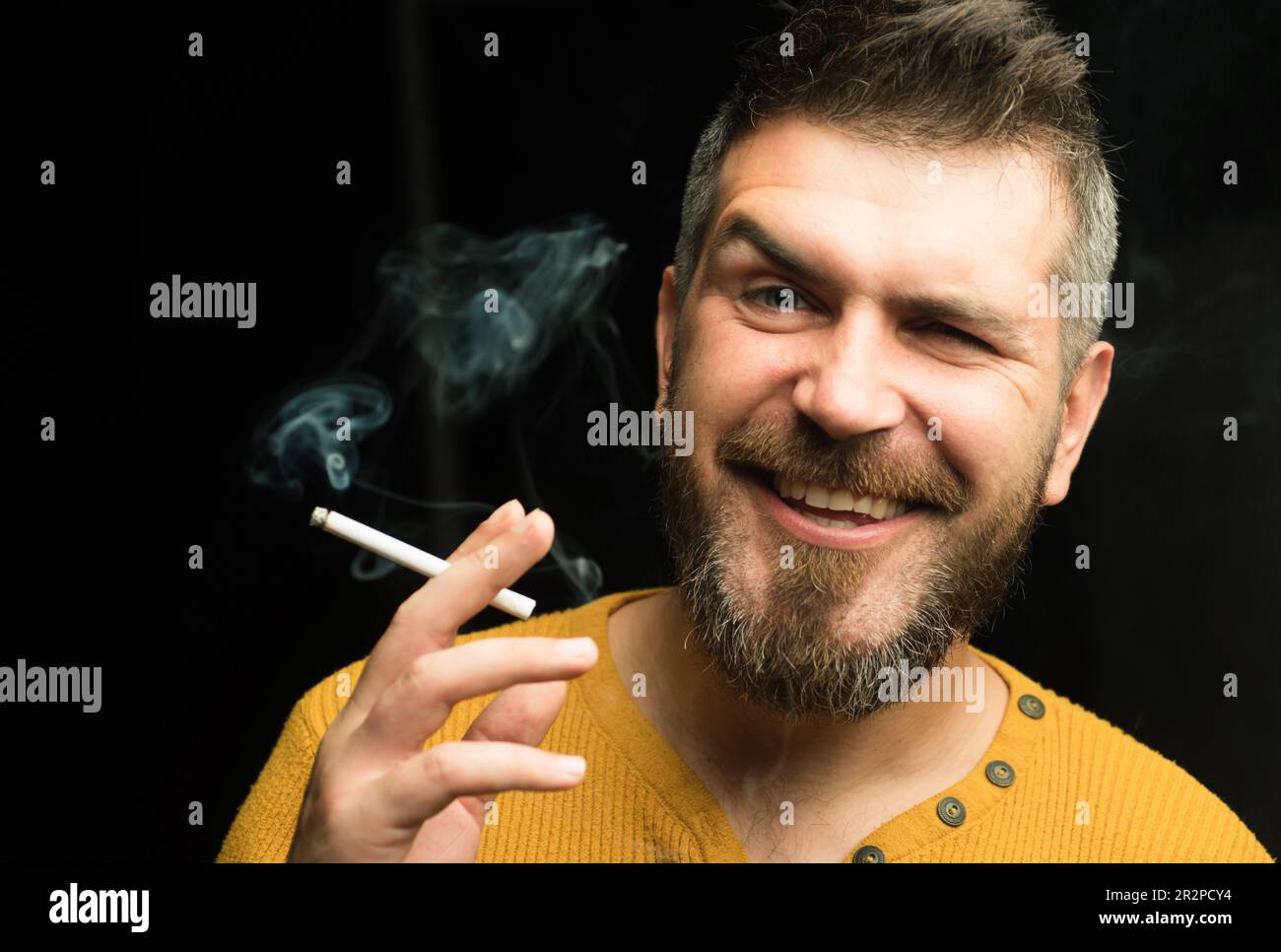 Stop smoking addiction. Bad guy addict with a syringe using drugs ...