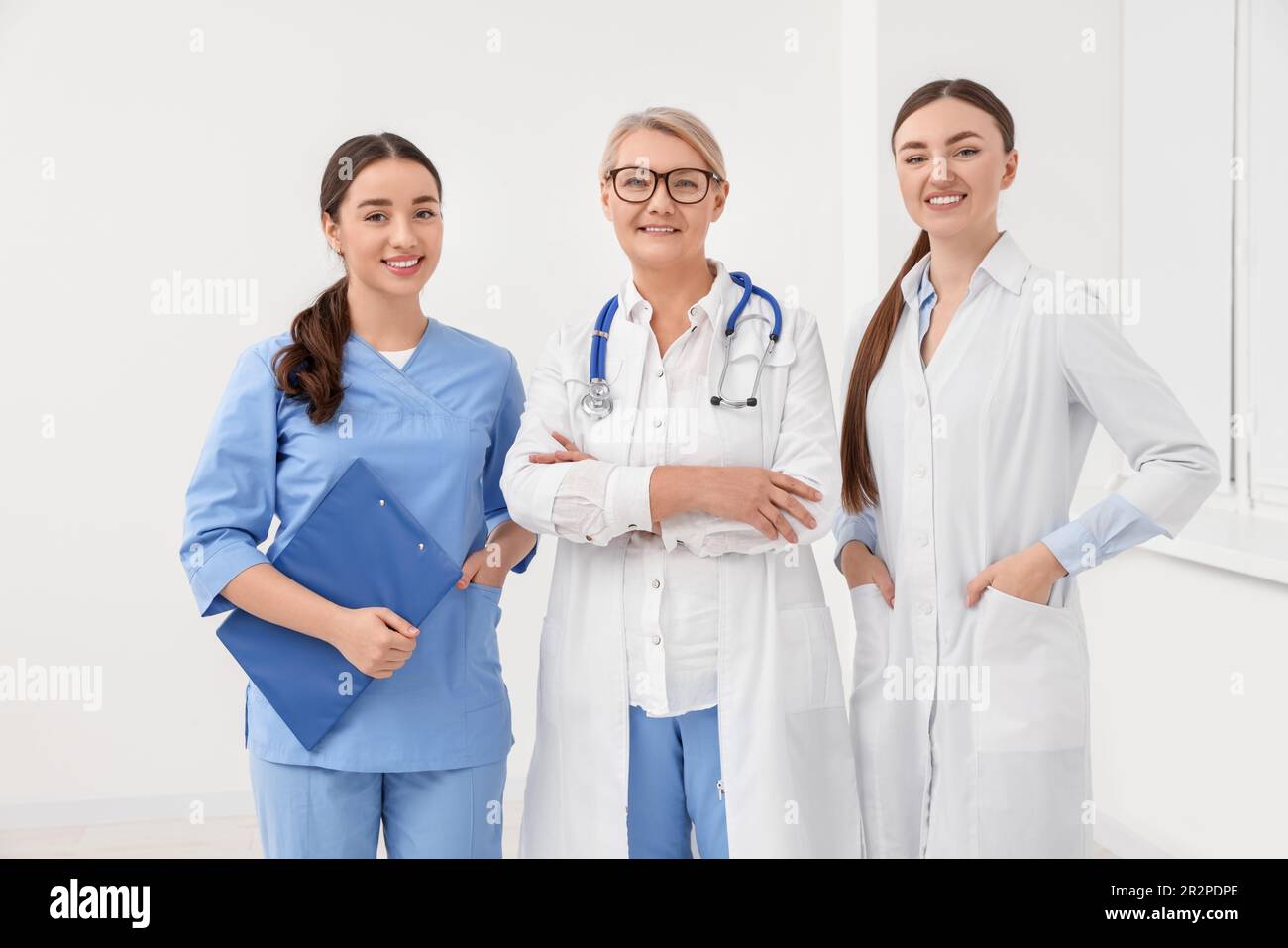 Portrait of medical doctors wearing uniforms indoors Stock Photo - Alamy