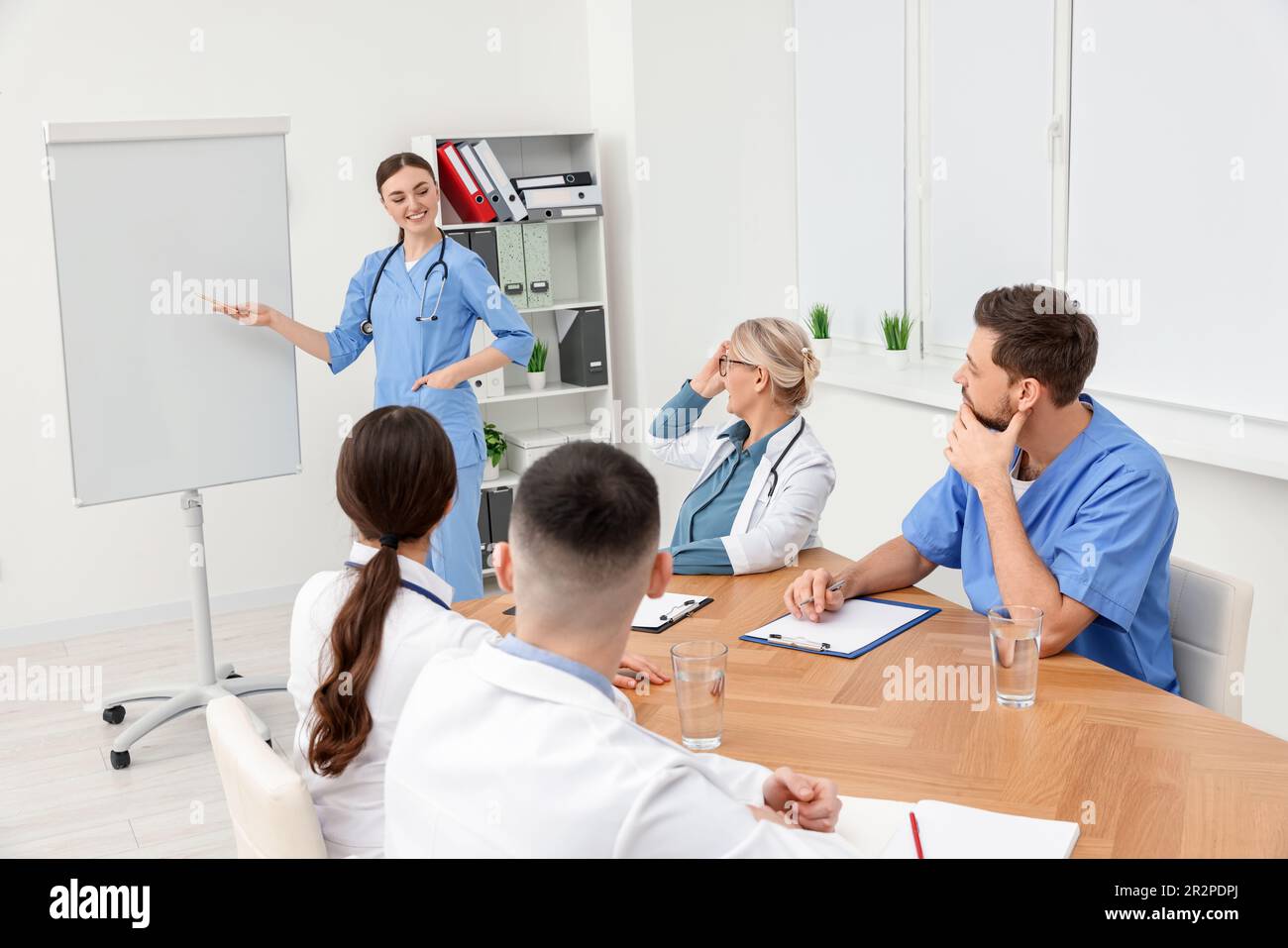 Doctor giving lecture near hi-res stock photography and images - Alamy