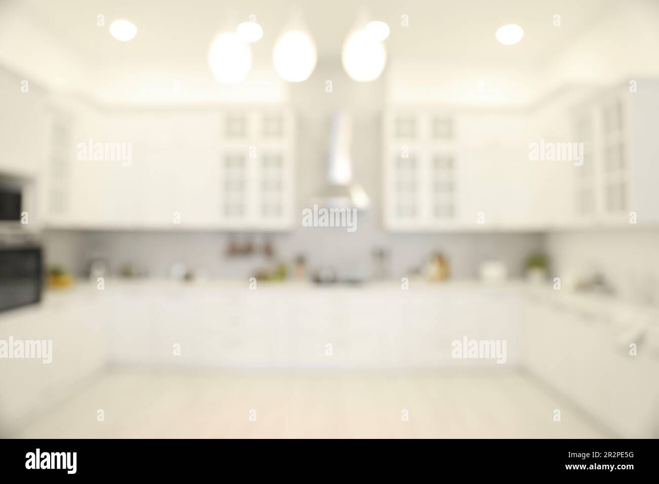 Blurred view of modern kitchen. Interior design Stock Photo - Alamy