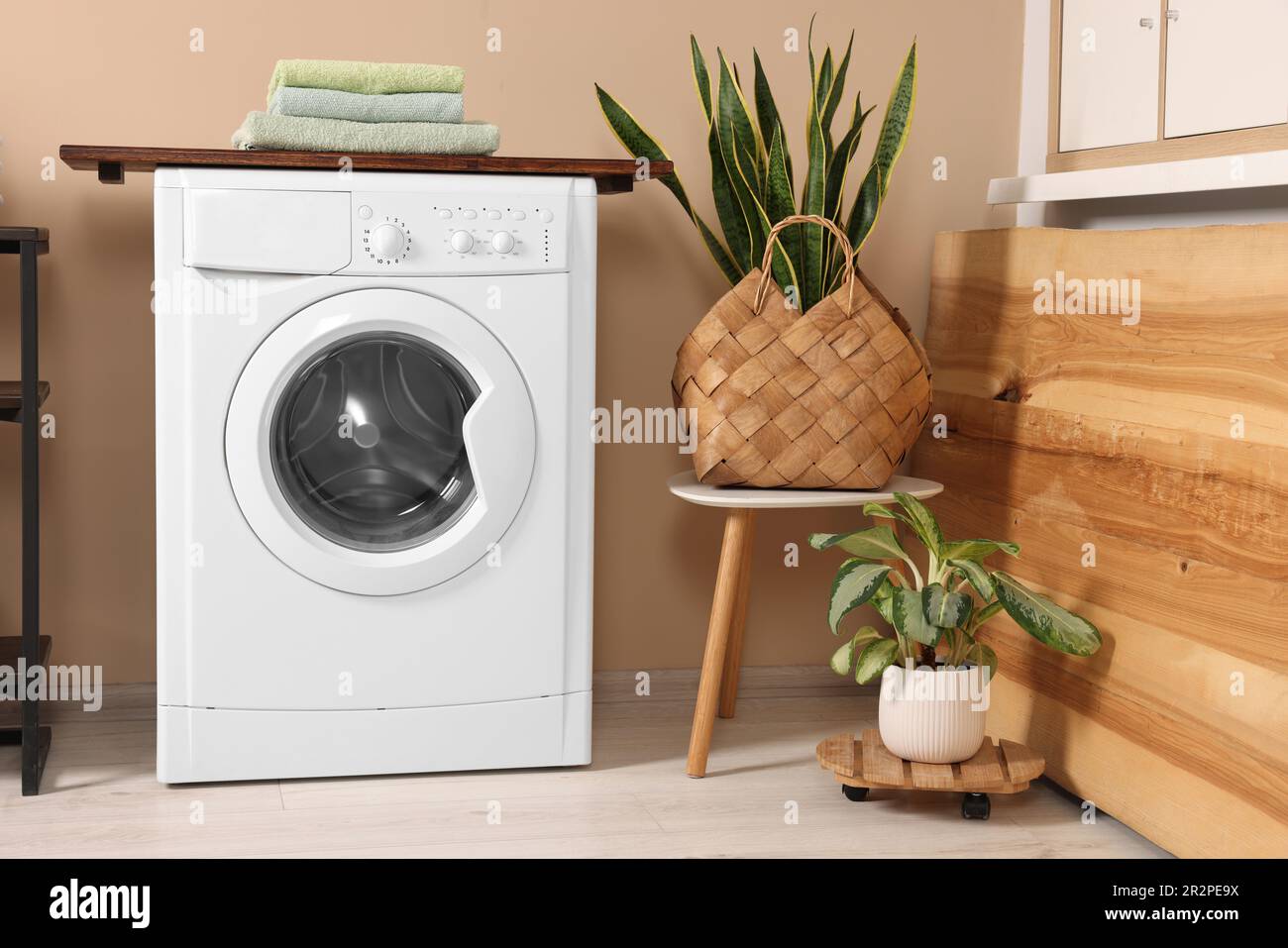 Stylish laundry room with modern washing machine. Interior design Stock ...