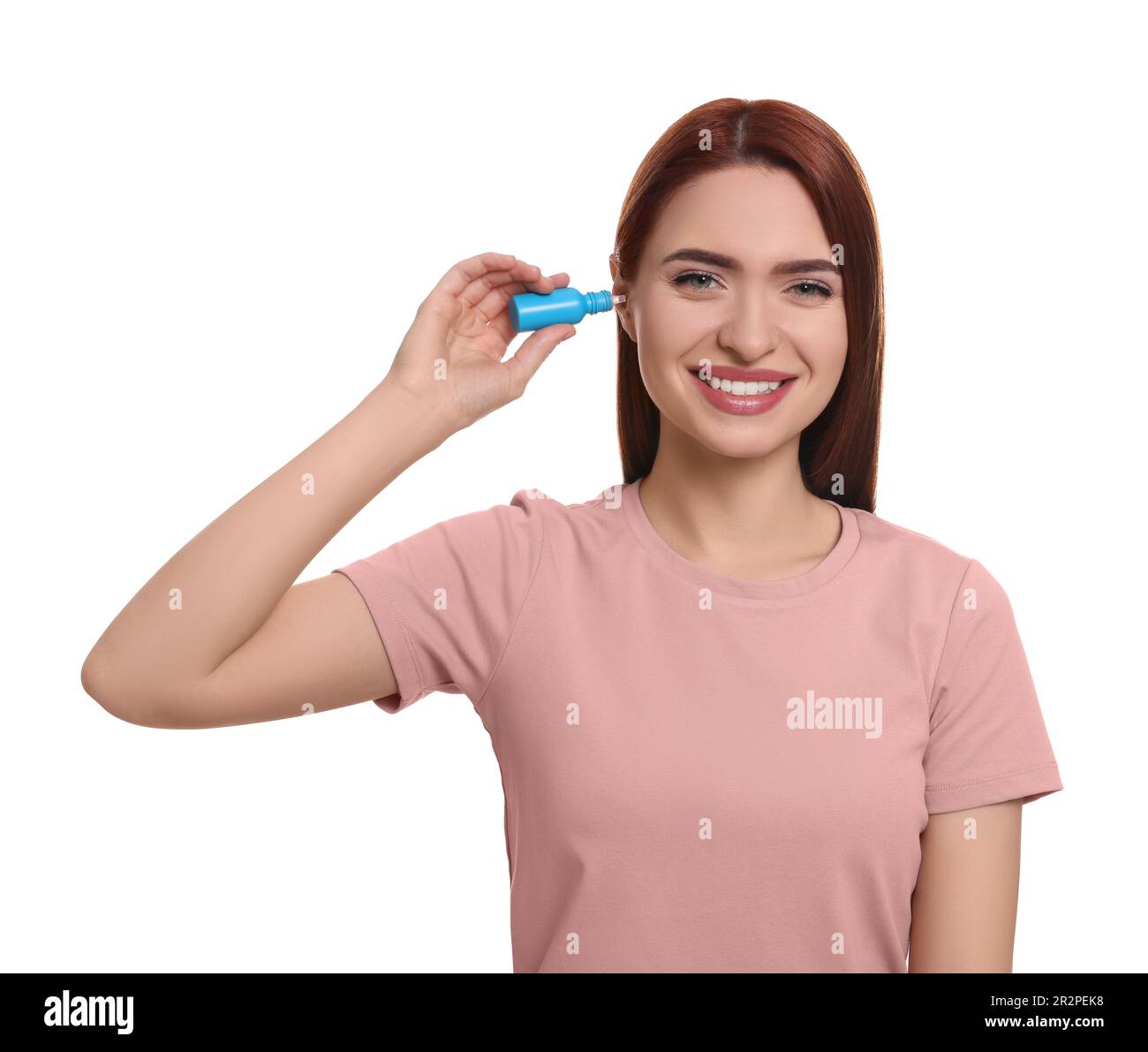 Woman using ear drops on white background Stock Photo - Alamy